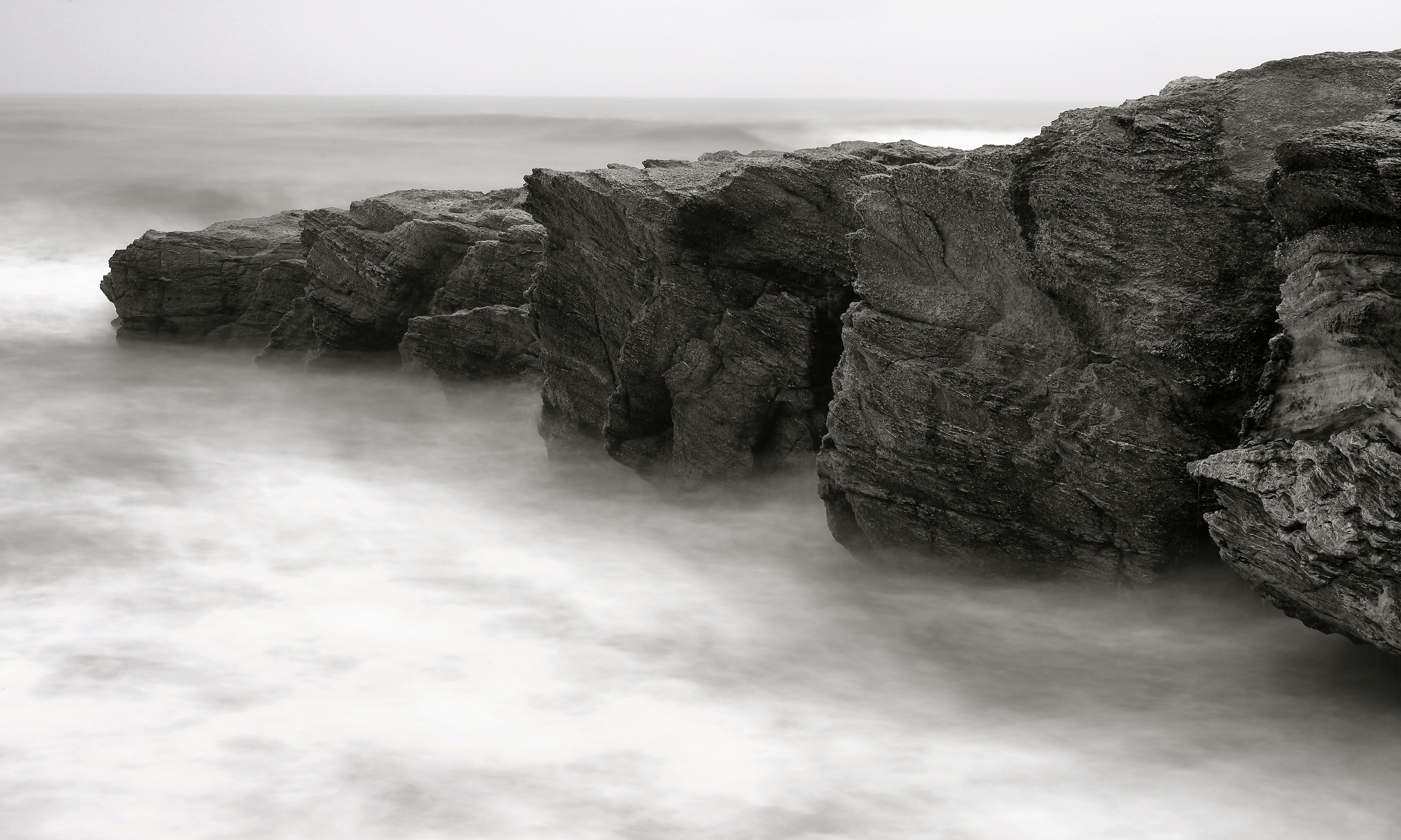 Whispers of the Ocean: A Rocky Embrace