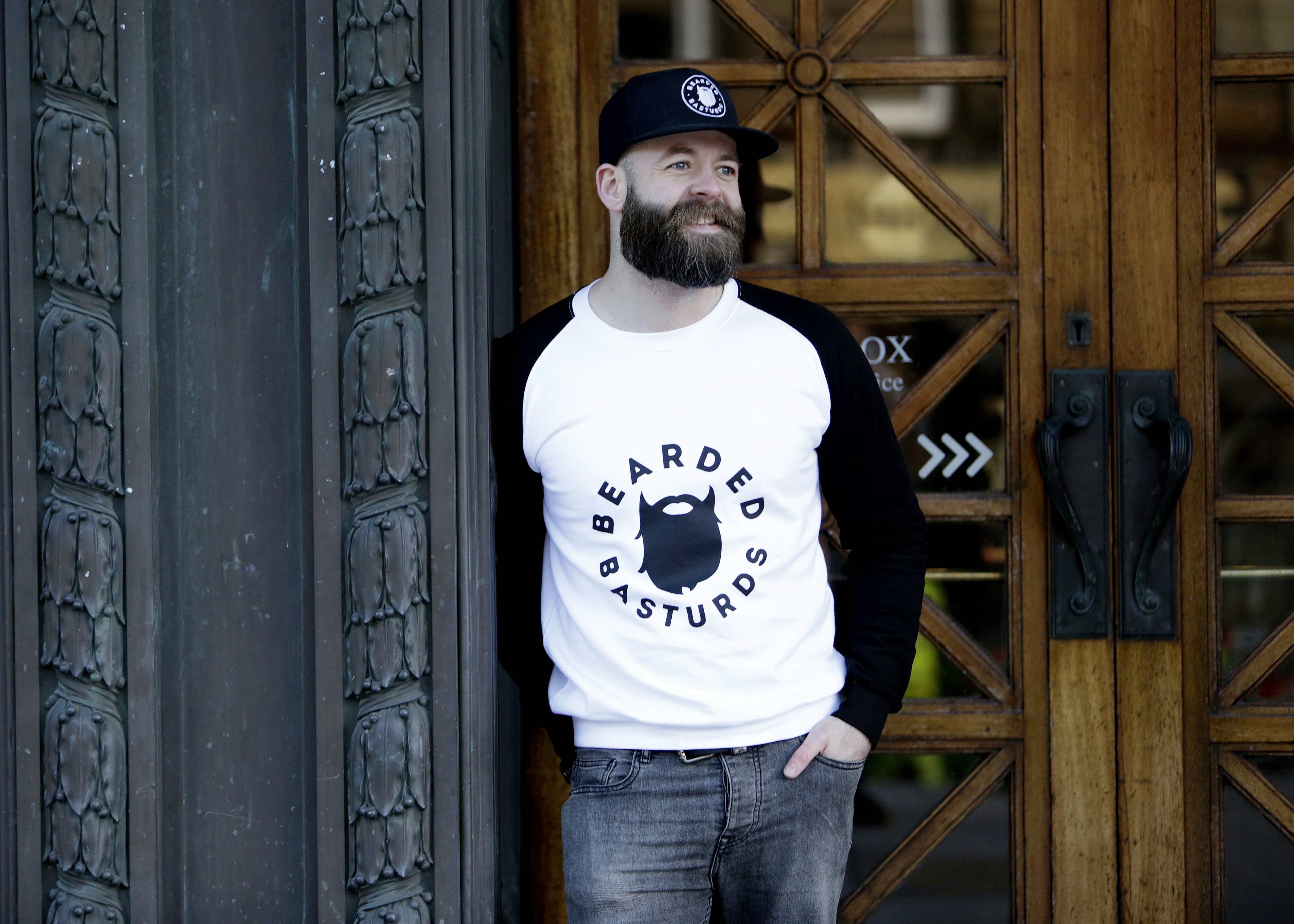 Bearded Enthusiast by a Carved Wooden Doorway