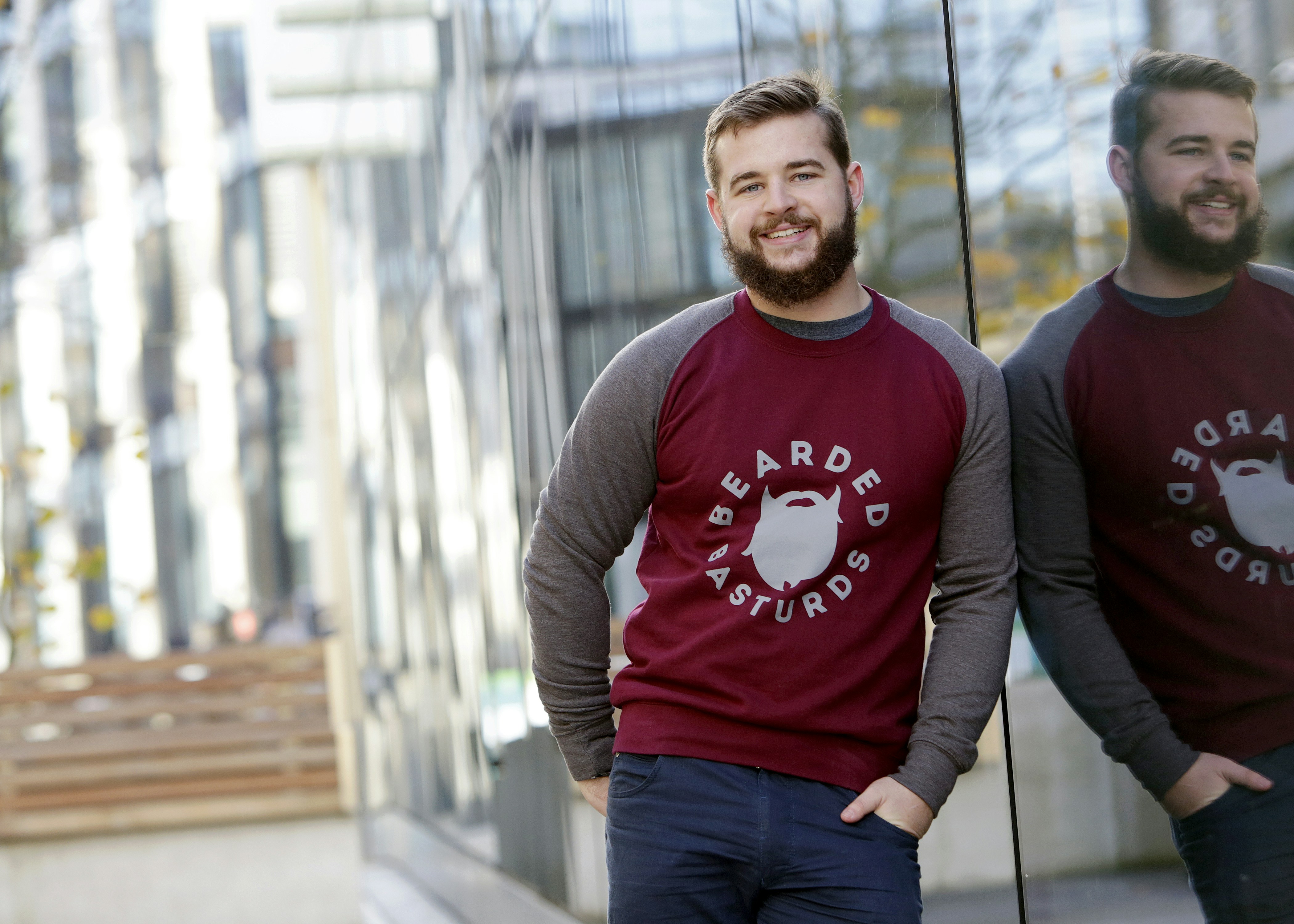 Echoes in Glass: A Casual Portrait by the Reflective Facade