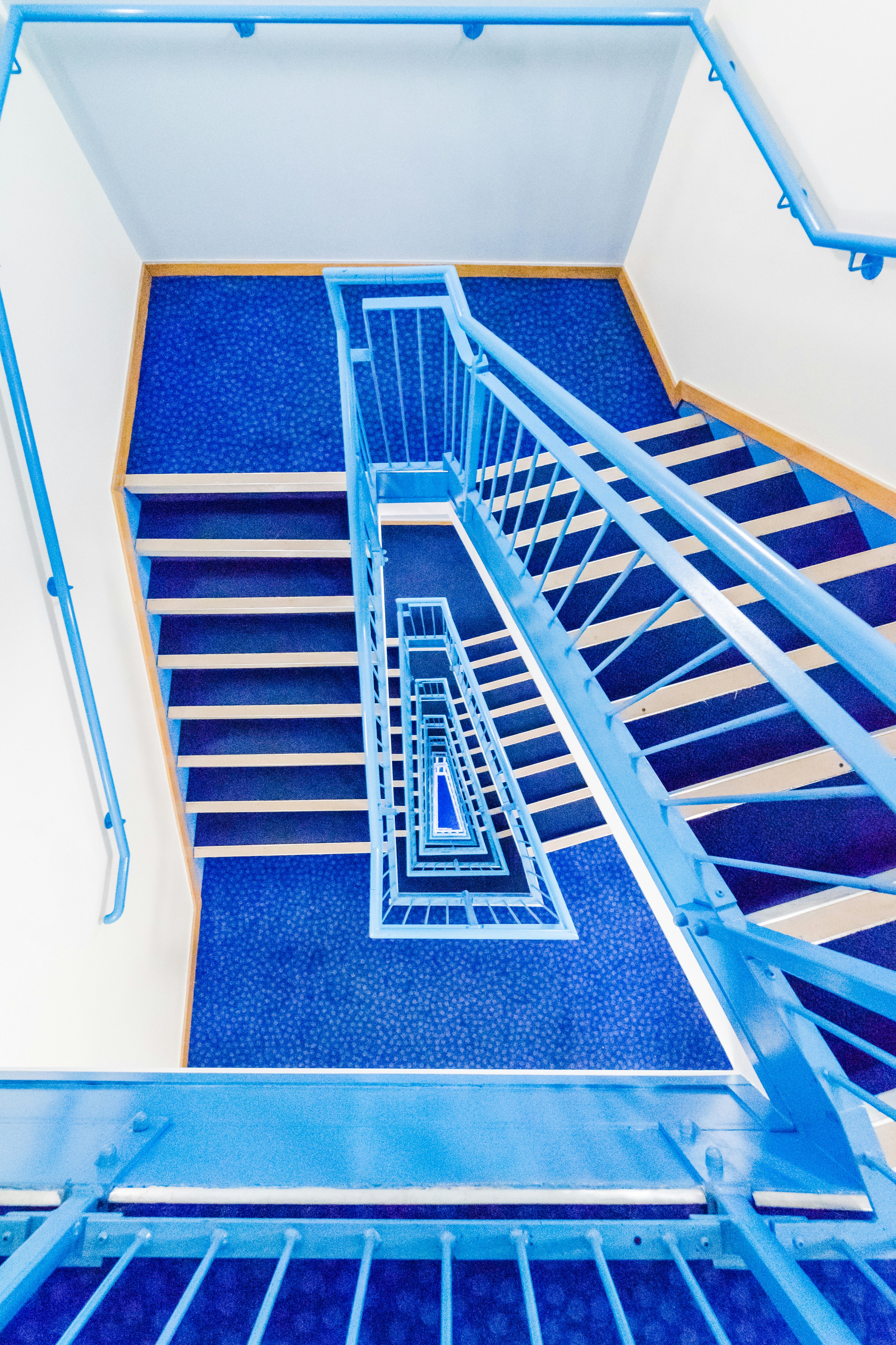 Blue metal stair handrails photo photo – Free Blue Image on Unsplash
