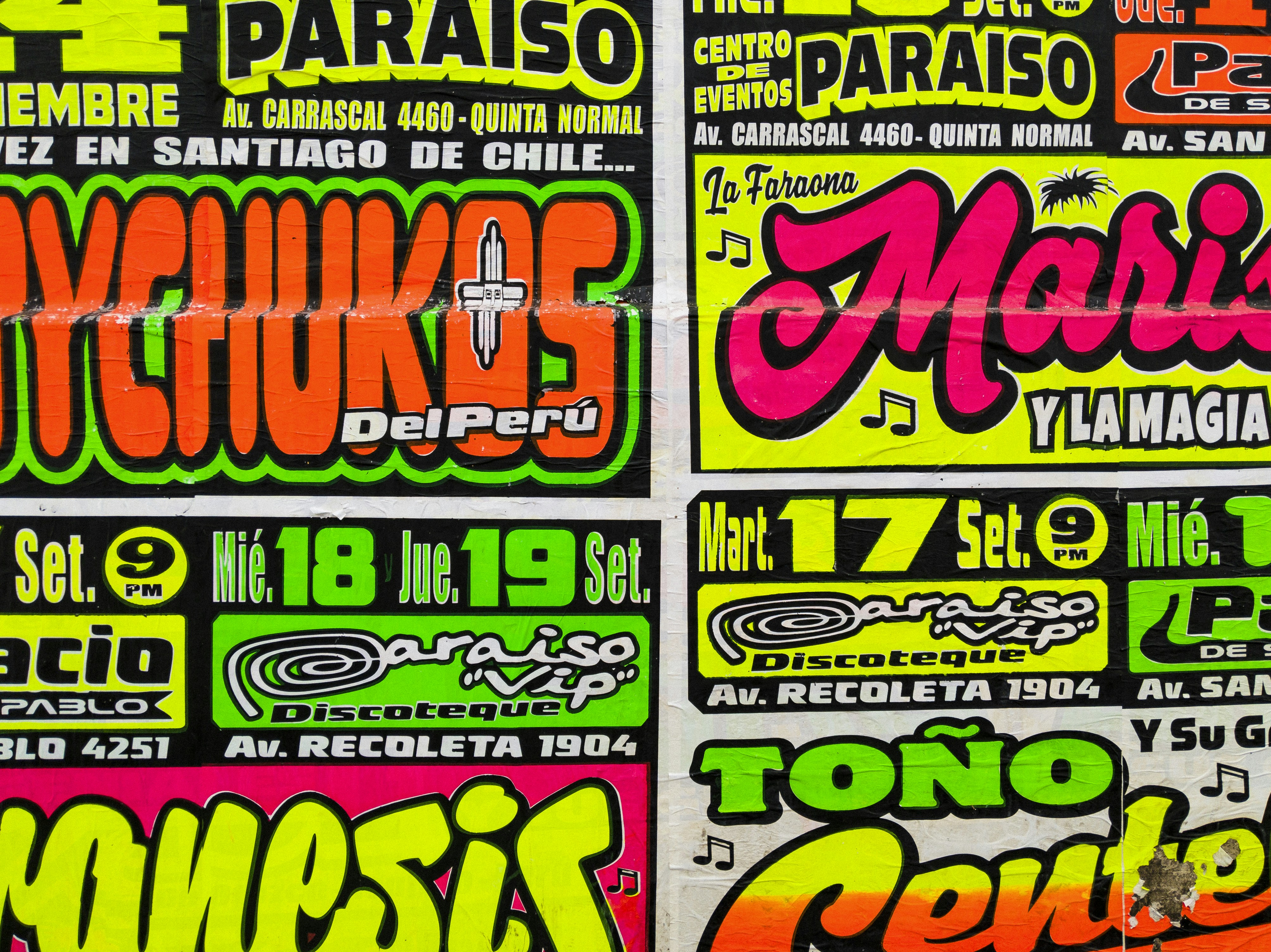 A bunch of posters that are on a wall photo – Free Text Image on Unsplash