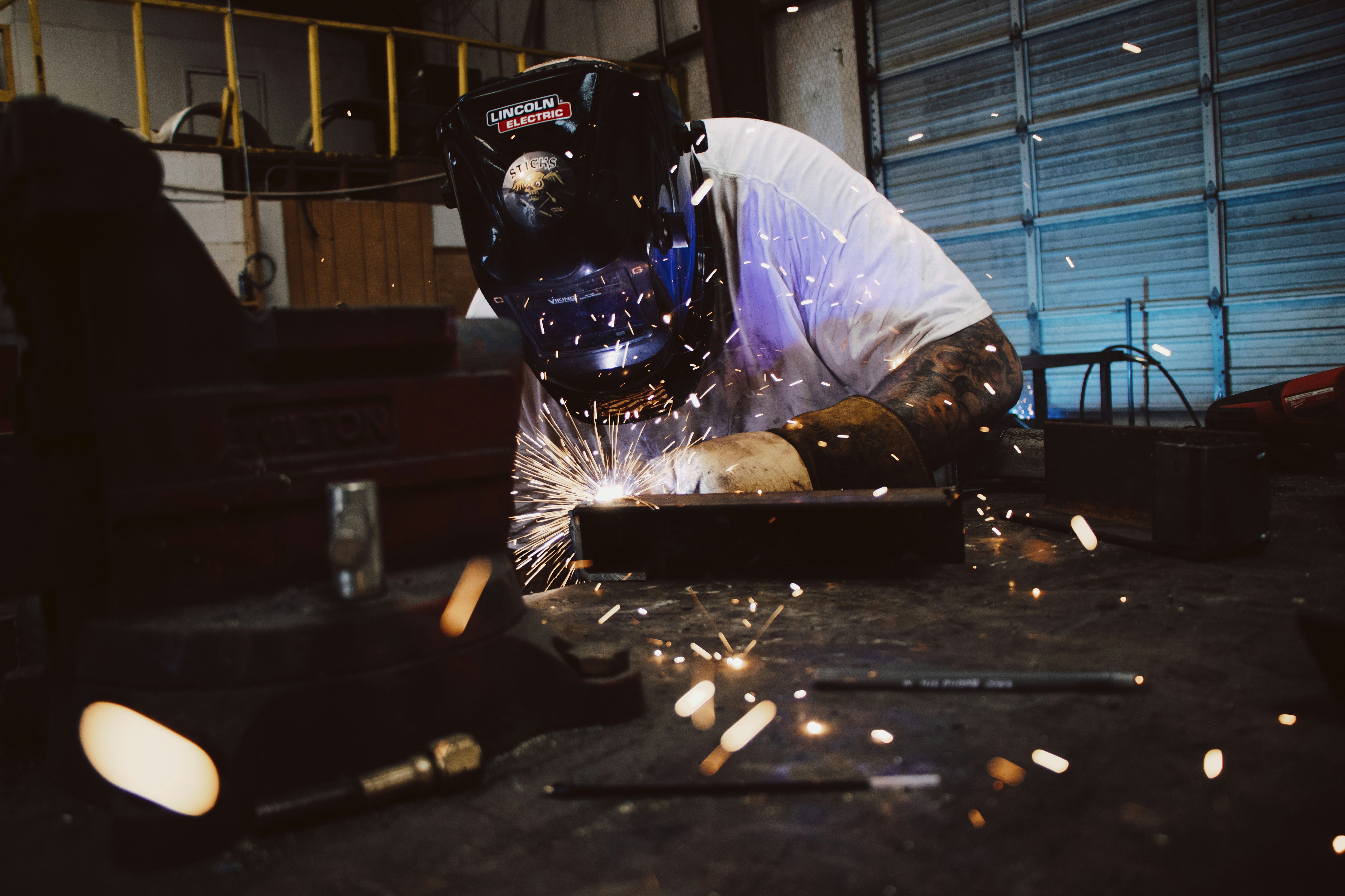 Man welding inside room photo – Free Human Image on Unsplash