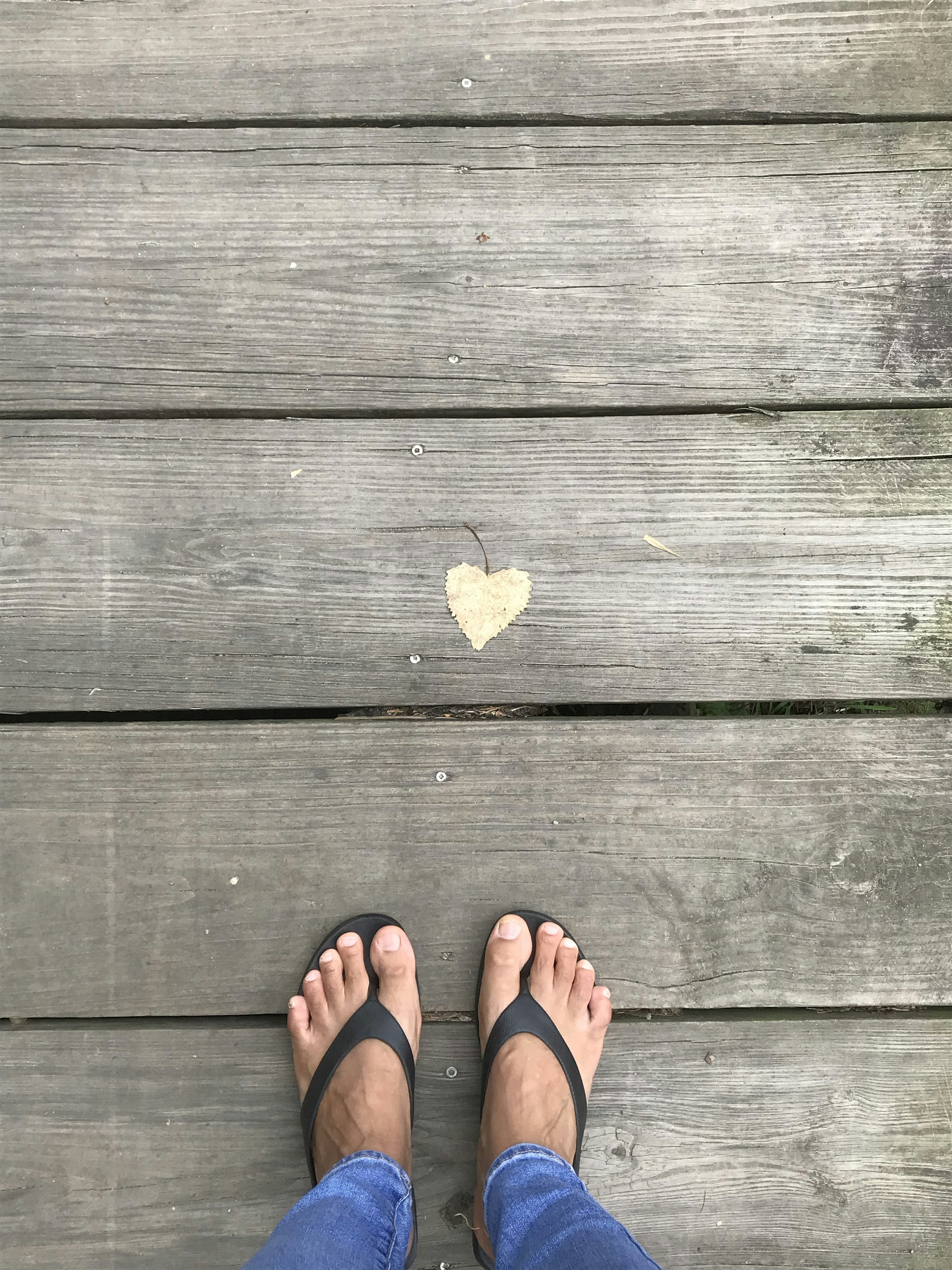 Heart-shaped Mark on Weathered Deck: A Quiet Step