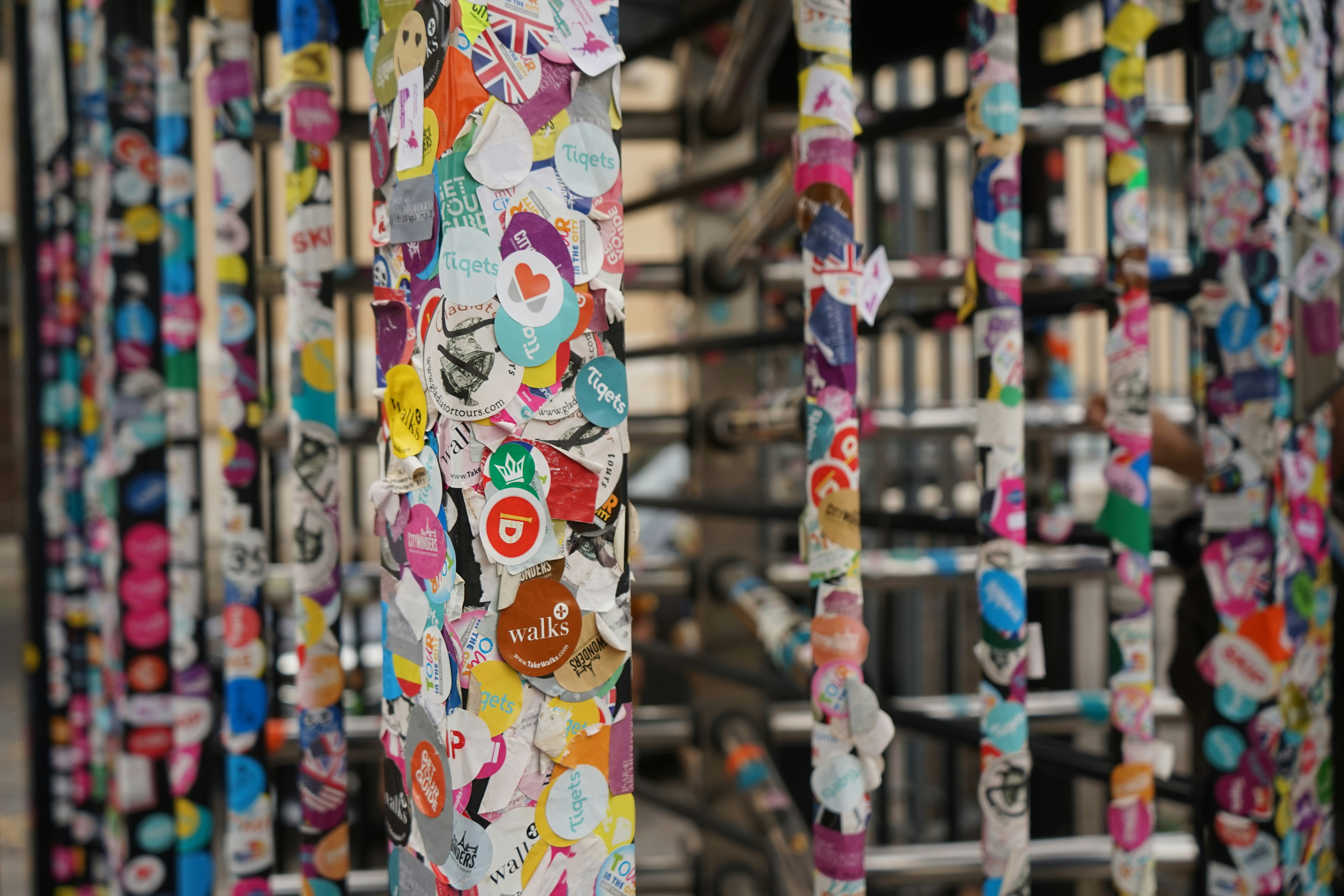 Stickerscape: A Corridor of Colorful, Logo-Wrapped Poles