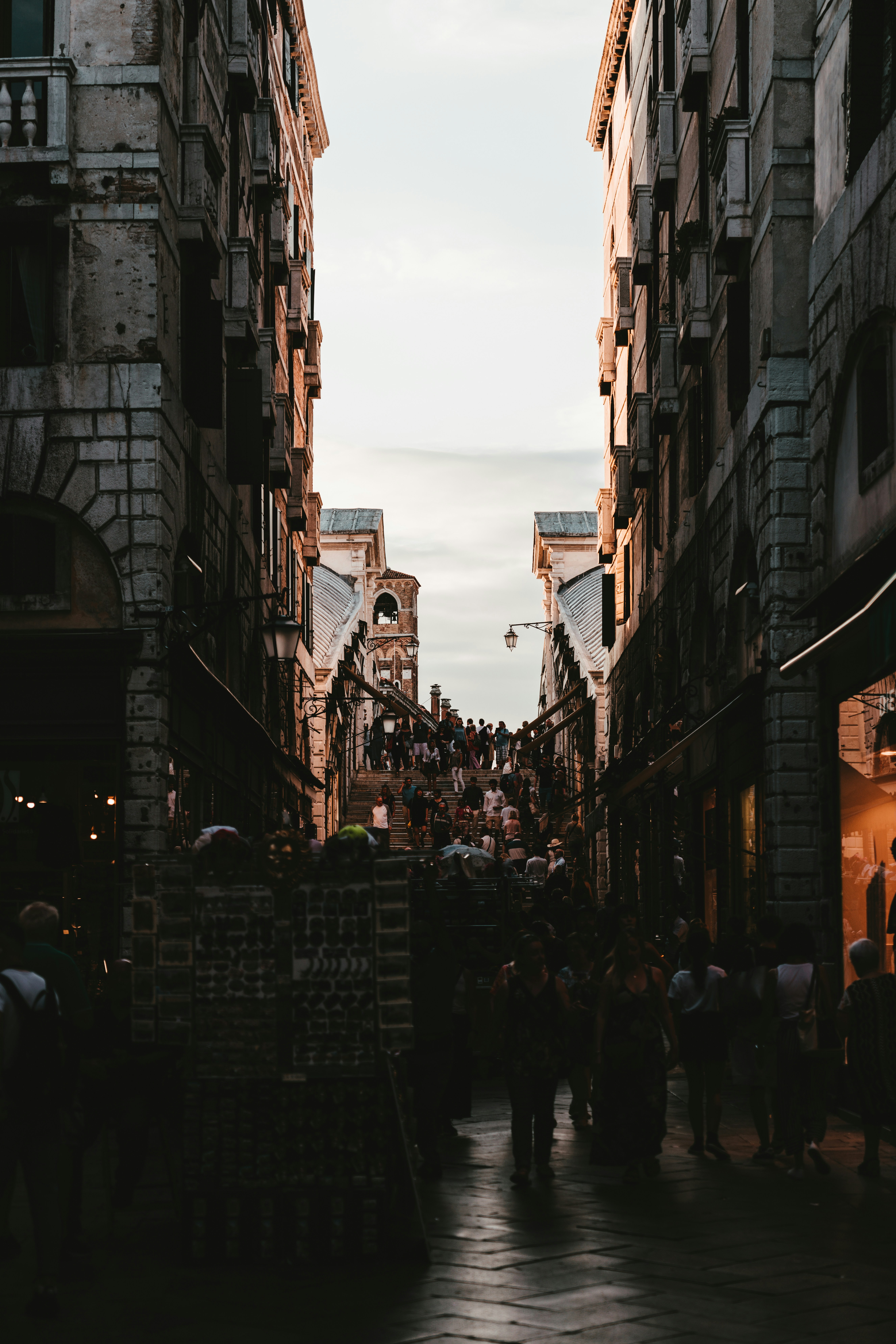 People walking between buildings photo – Free Venice Image on Unsplash