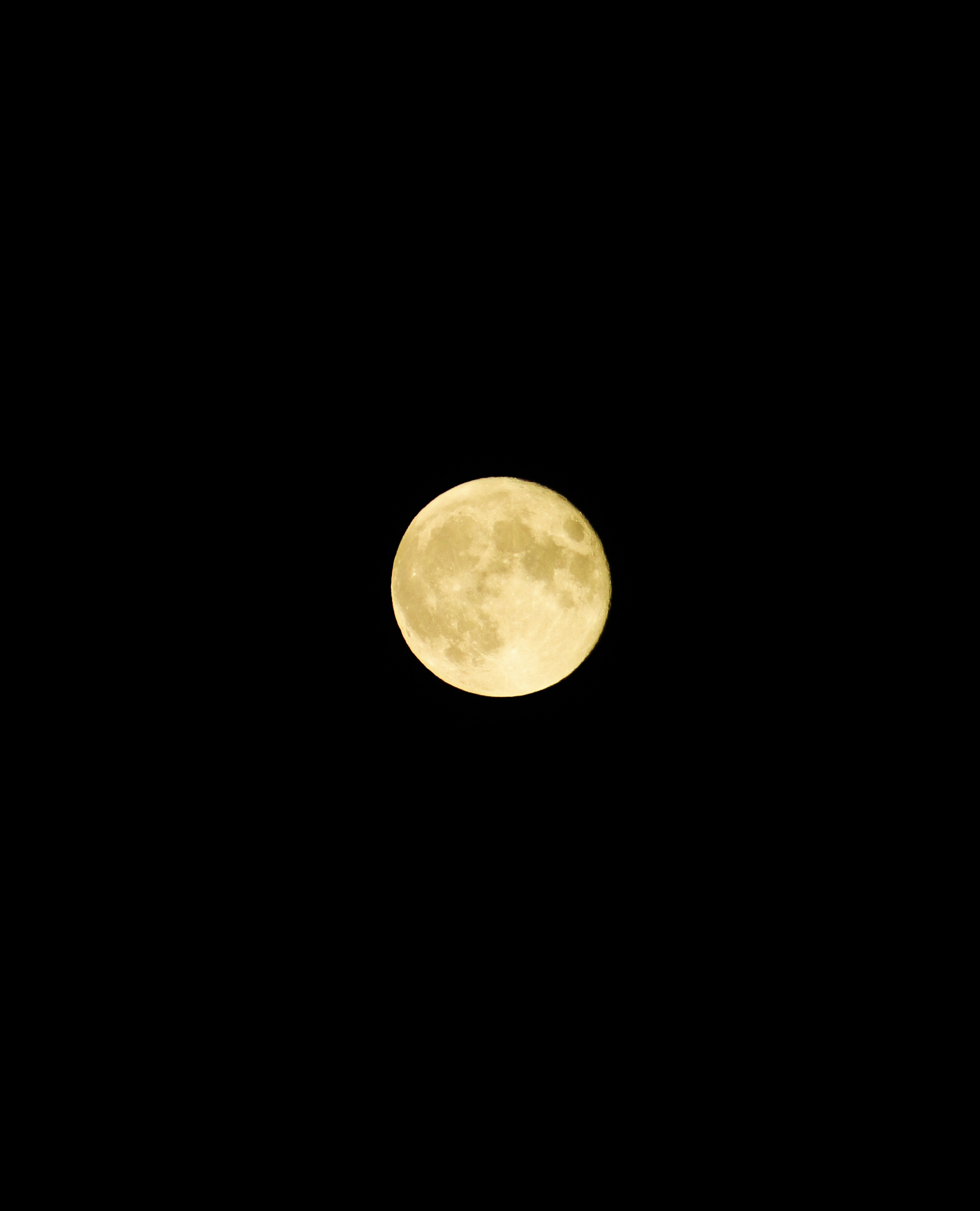 Full moon illuminated against a dark night sky.
