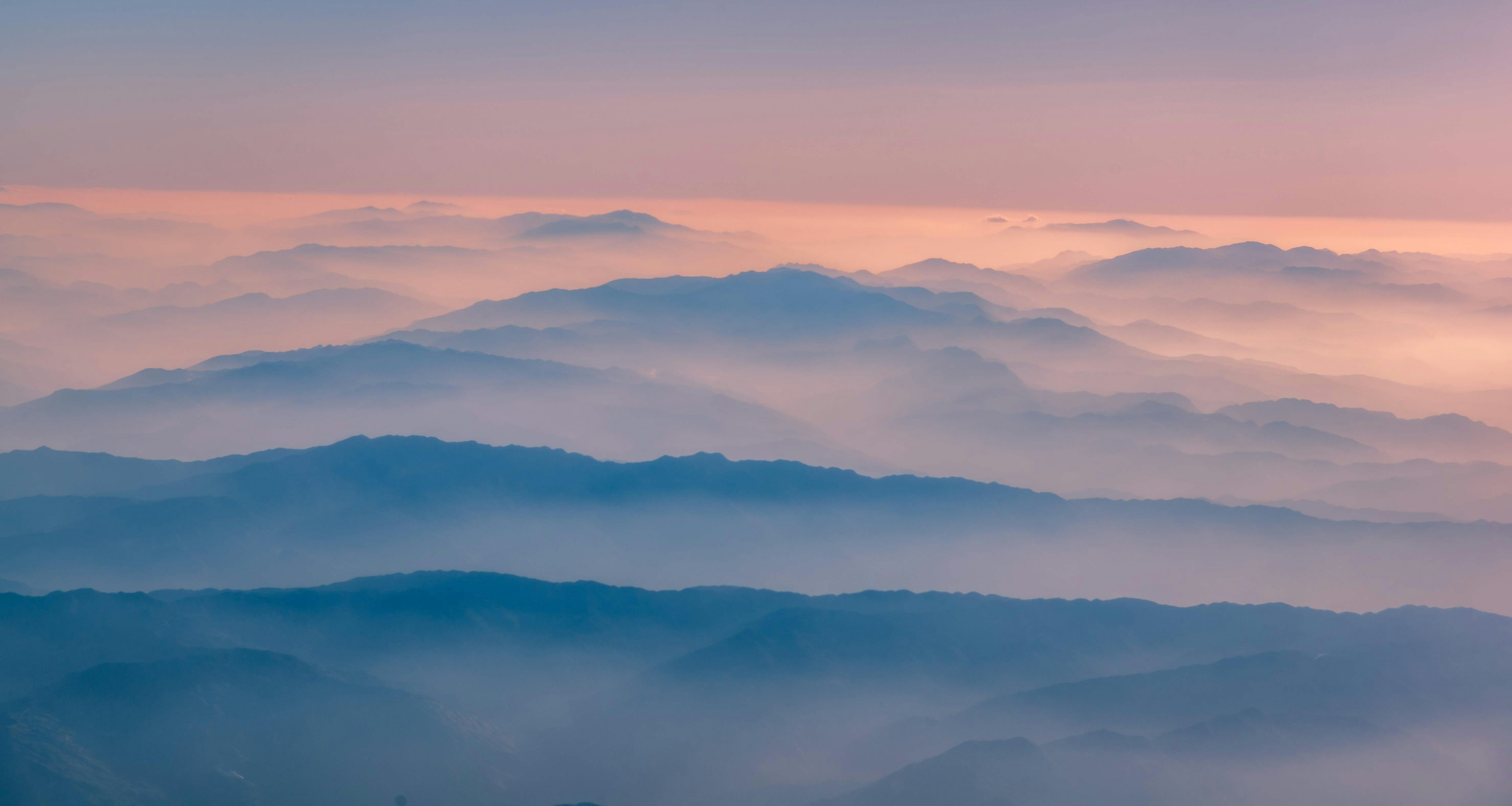 High-angle photography of mountains surrounded by clouds photo – Free ...