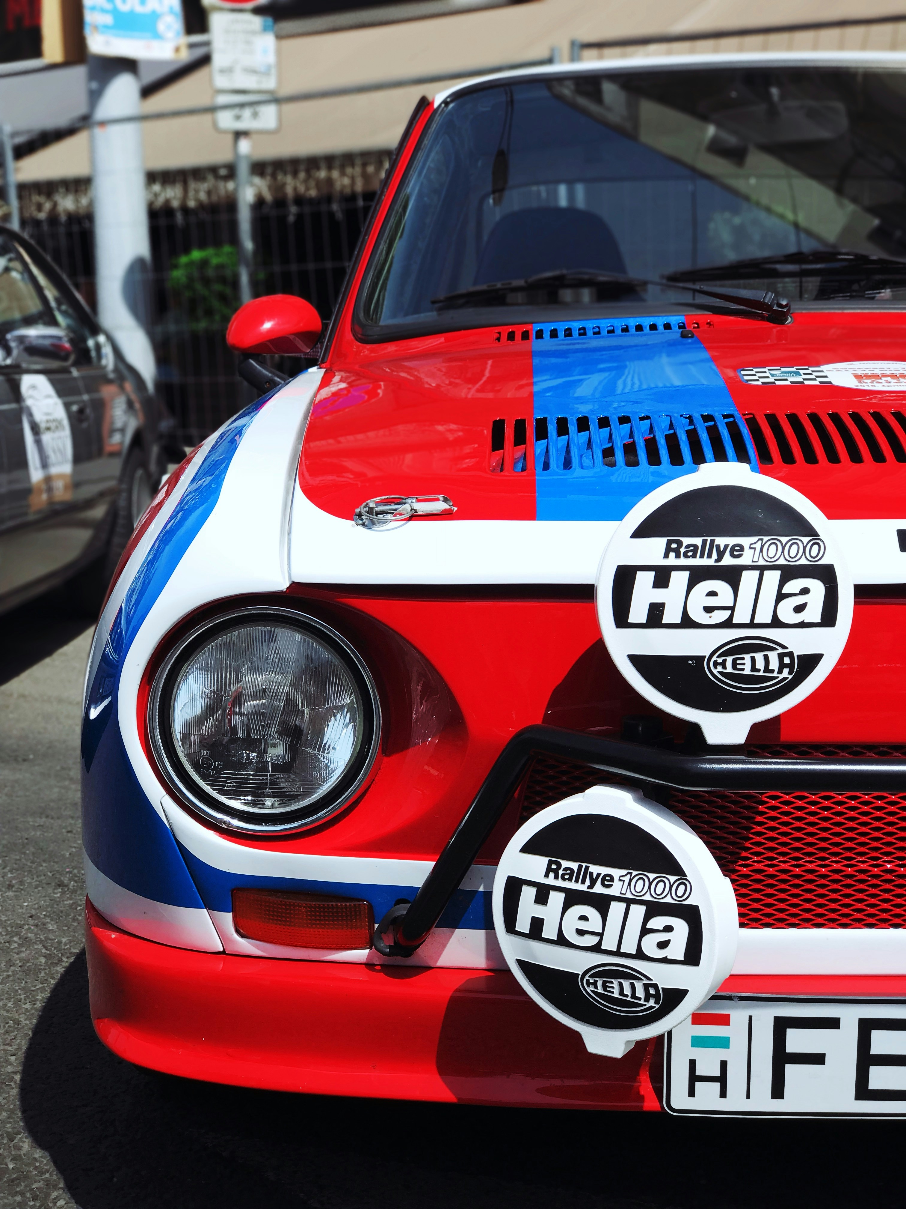 Red and blue Hella Rallye 1000 parking near road photo – Free ...