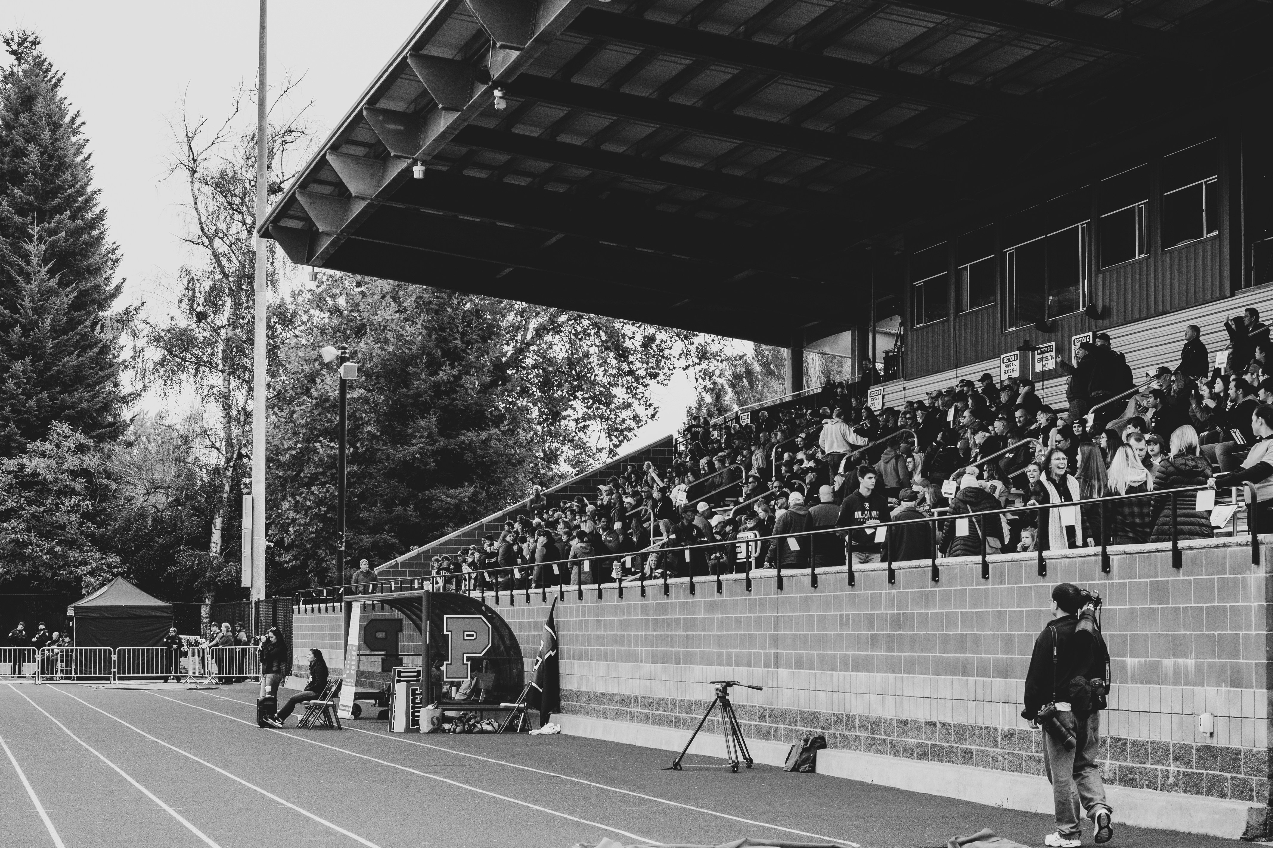 Standby at the Edge: Spectators watching a daytime track meet