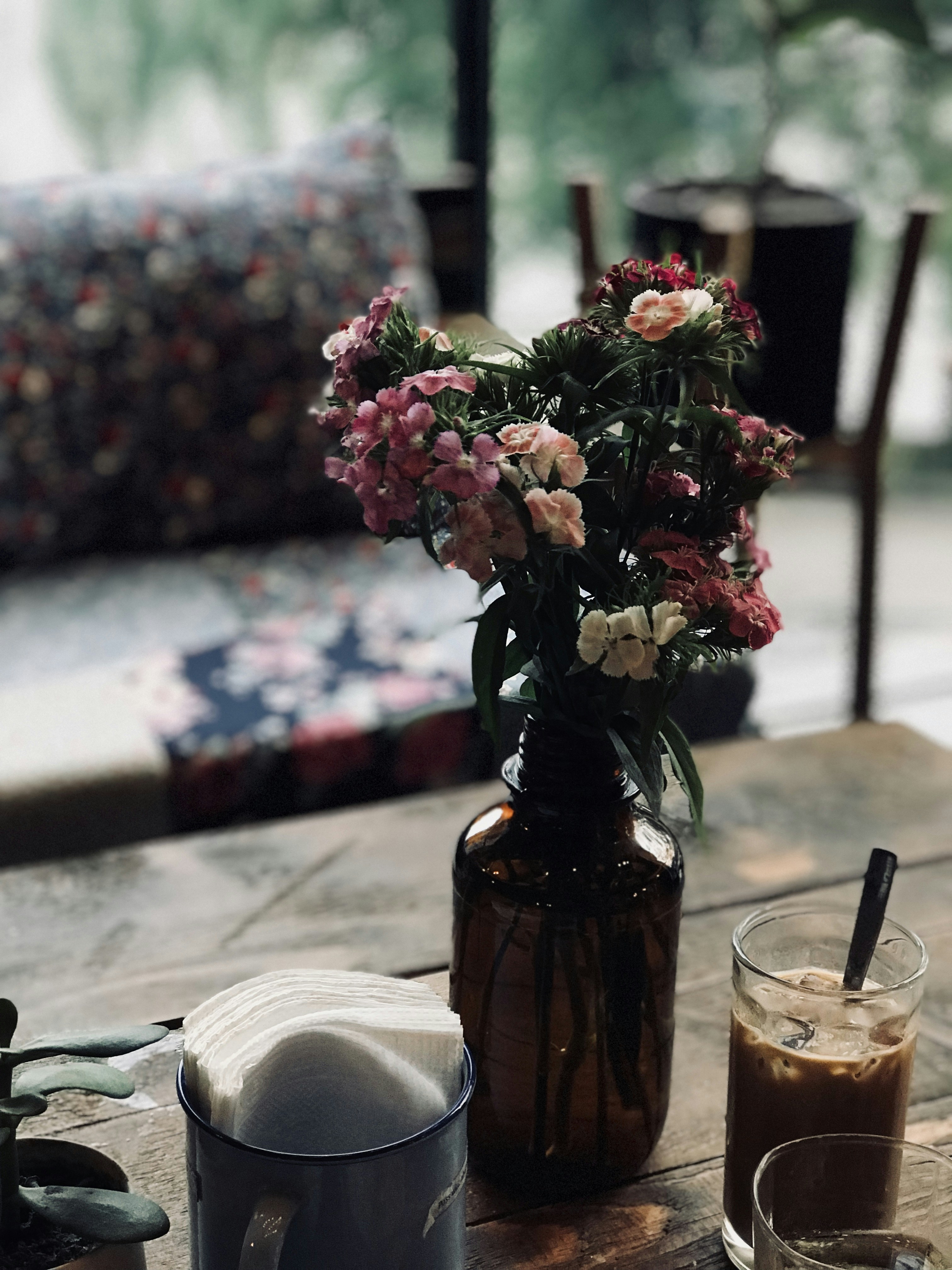 Glass Vase Bouquet on Rustic Table with Iced Coffee