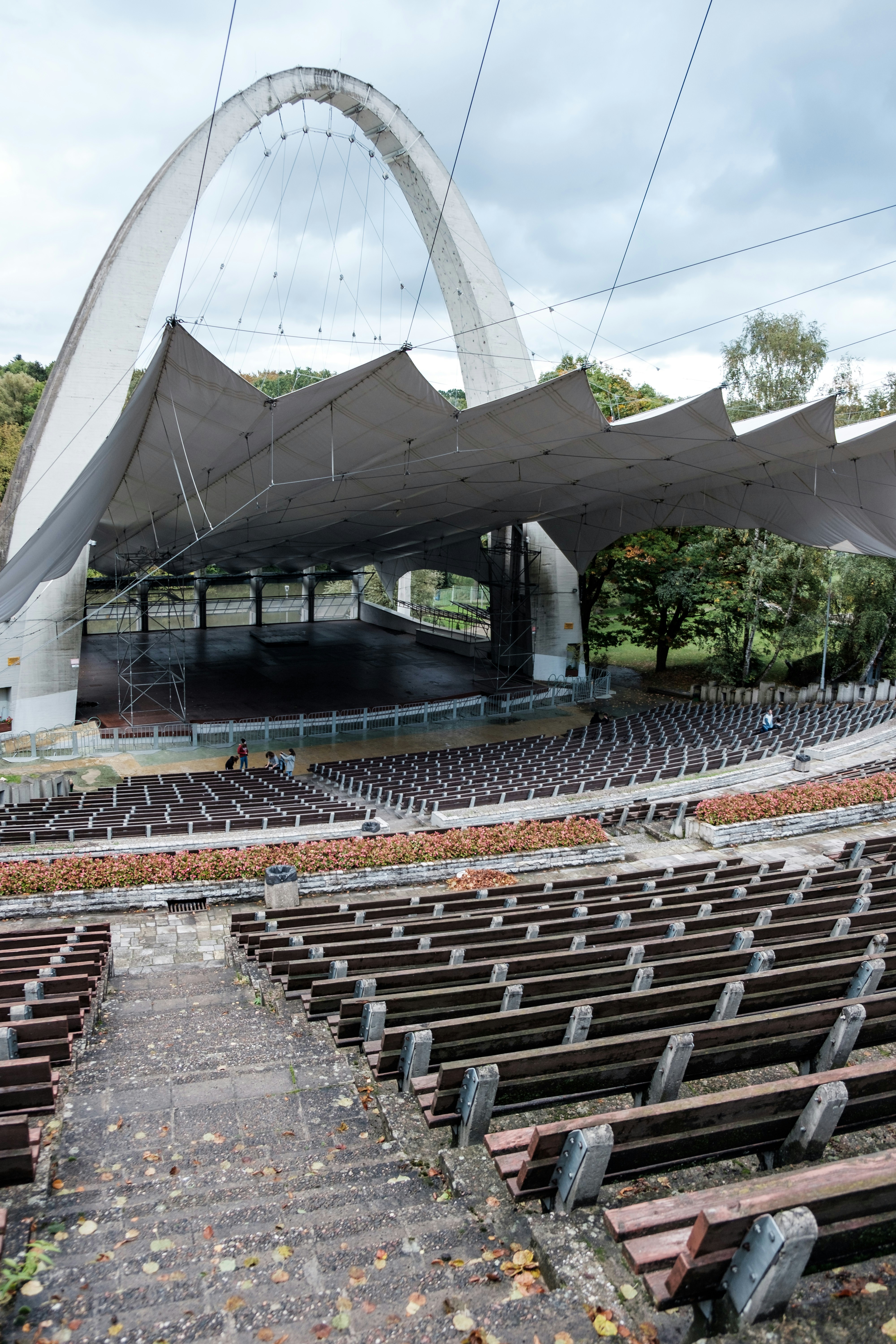 Overcast canopy over an open-air amphitheater with tiered seating