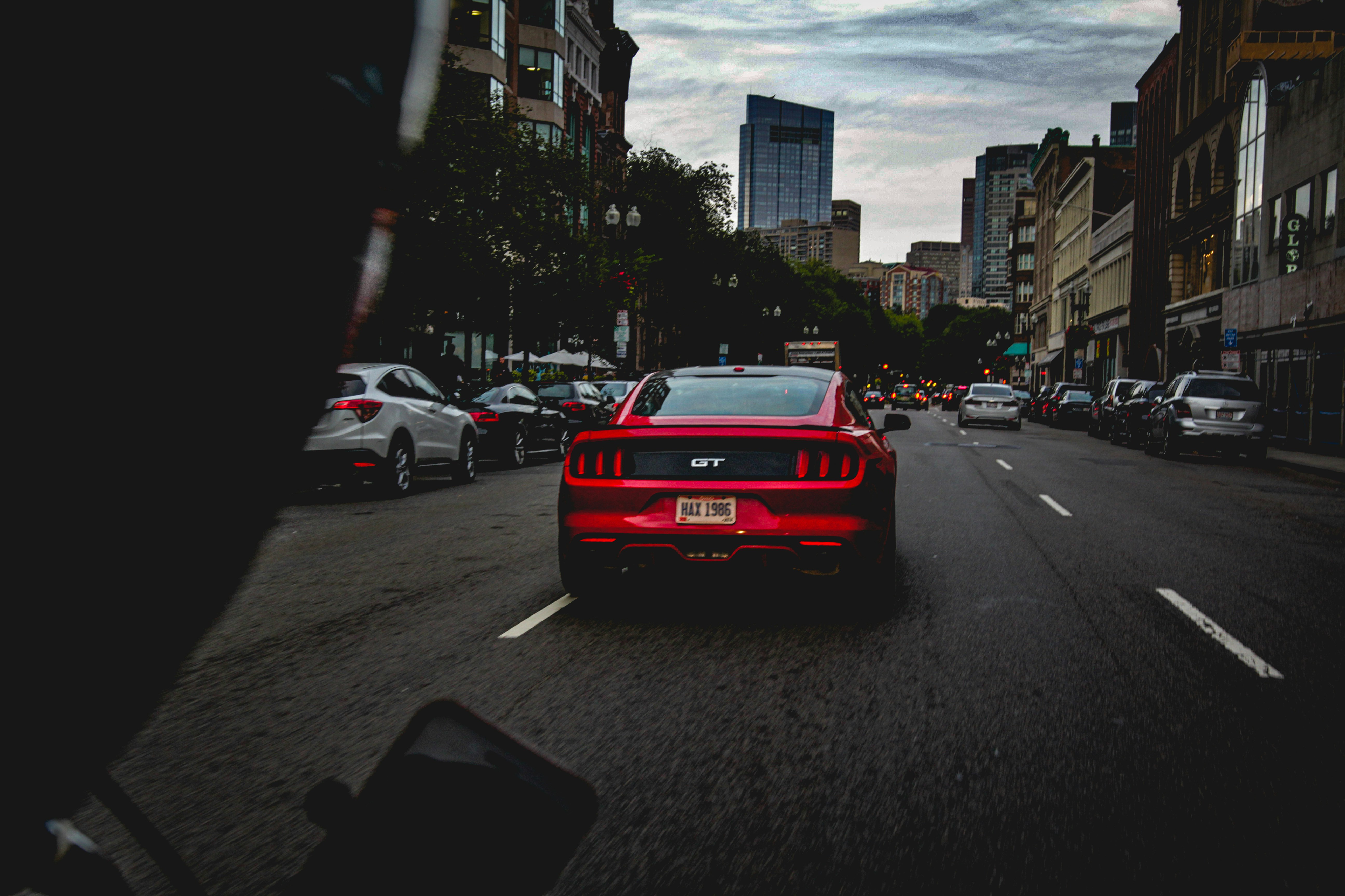 Scarlet Mustang Central: City Street at Dusk