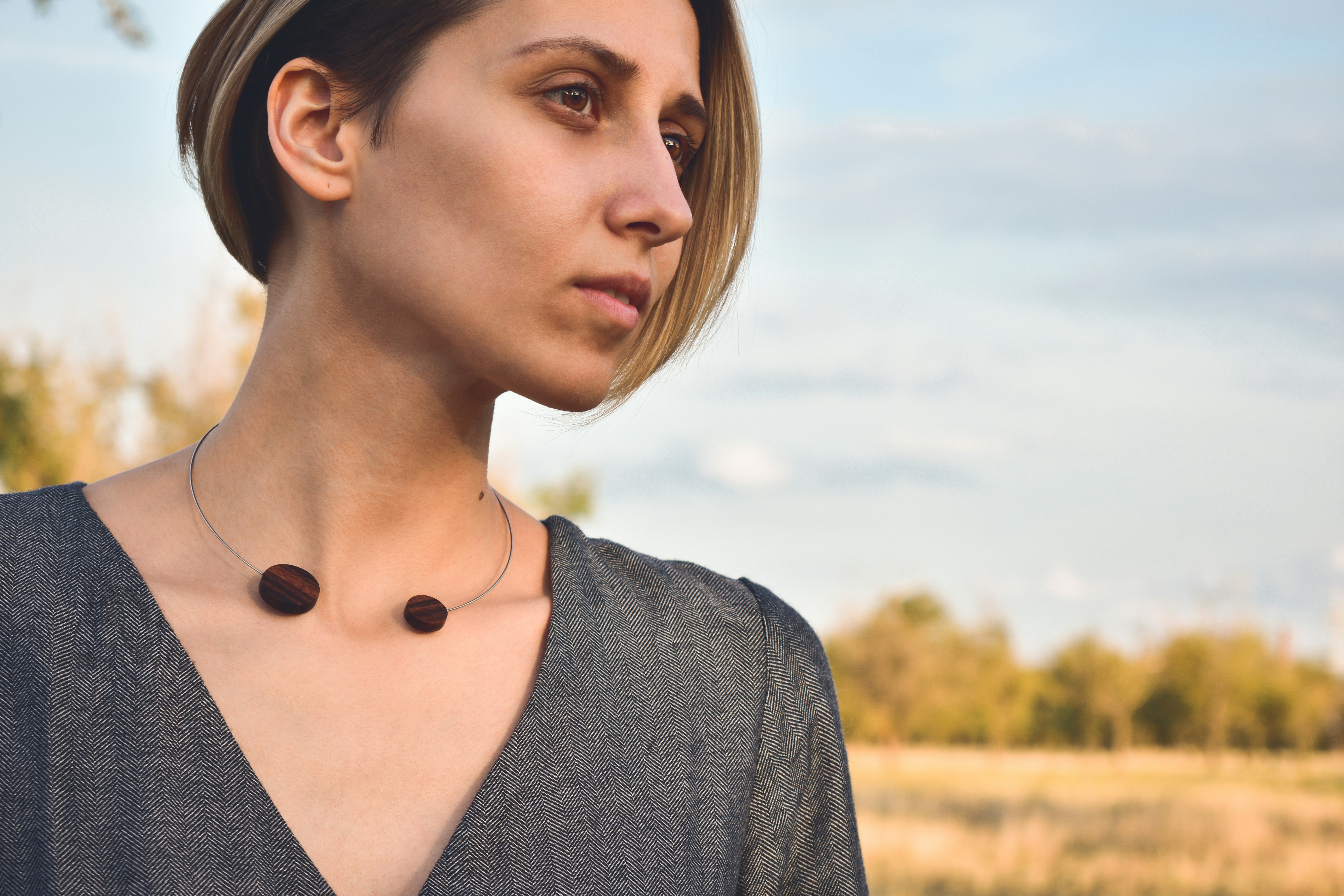Portrait in Warm Light: A contemplative gaze against an open landscape