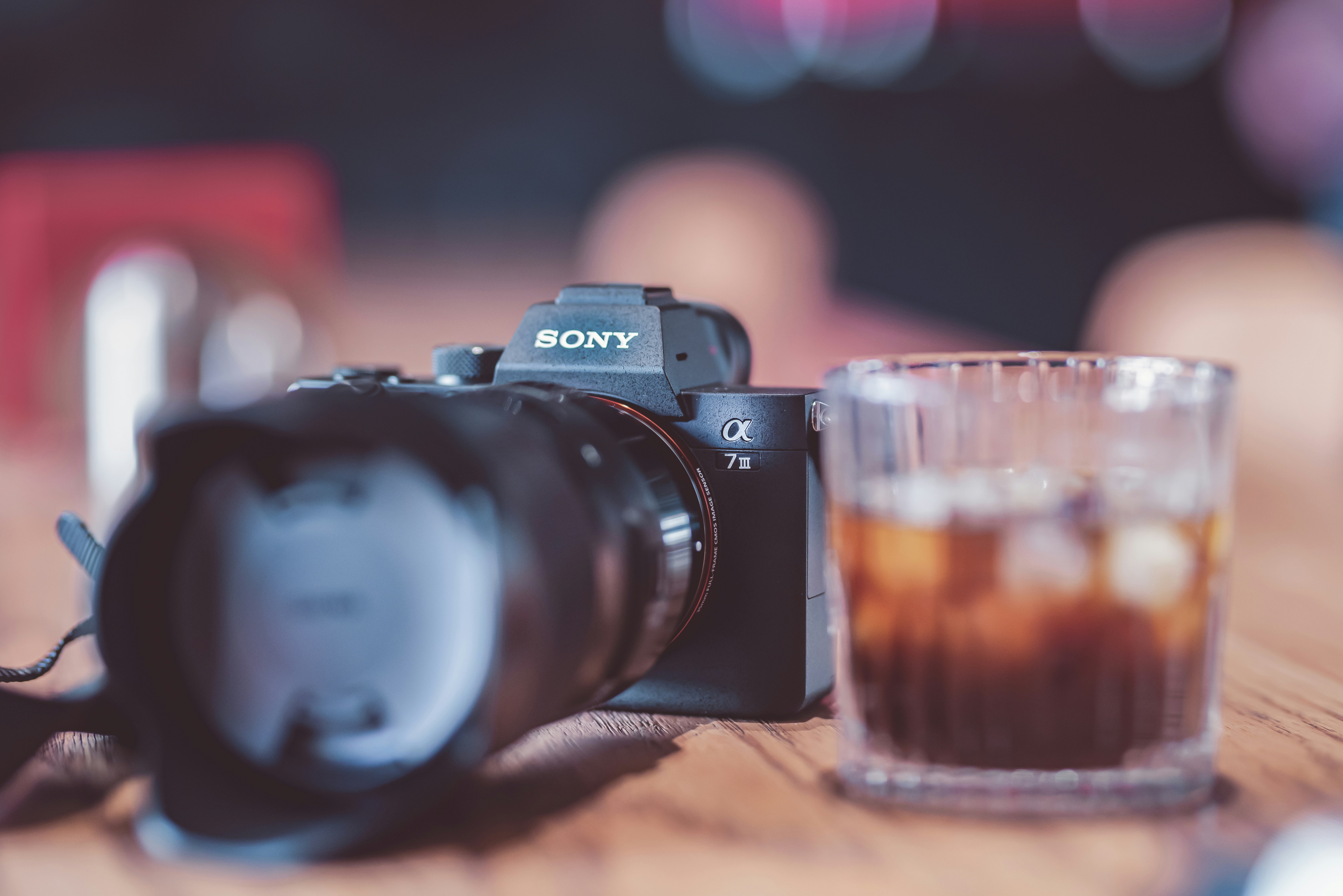 Glass, Grain and a Sony: A Close-Up of a Mirrorless on Wood