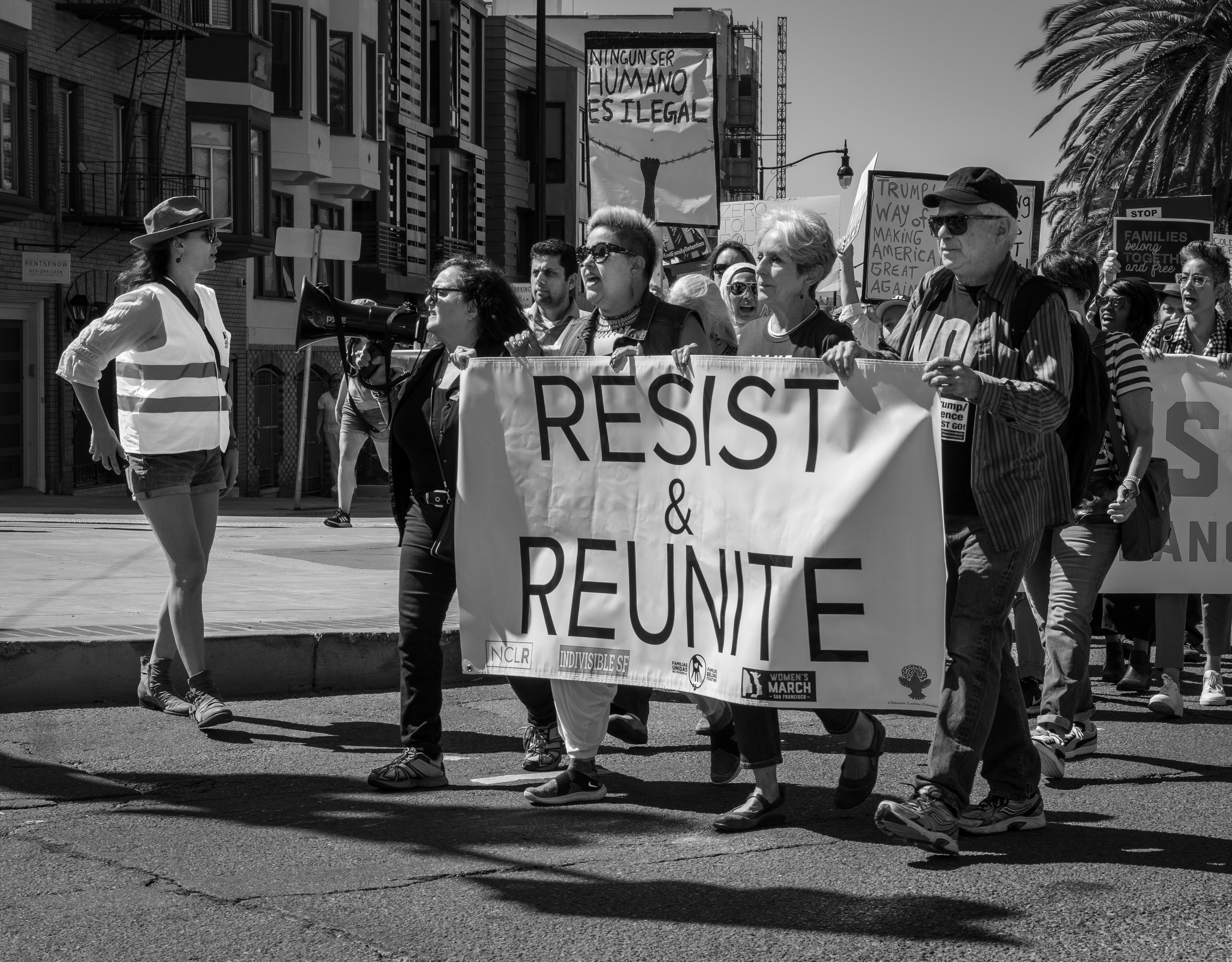 Grayscale photography of crowd of people rallying on street near ...