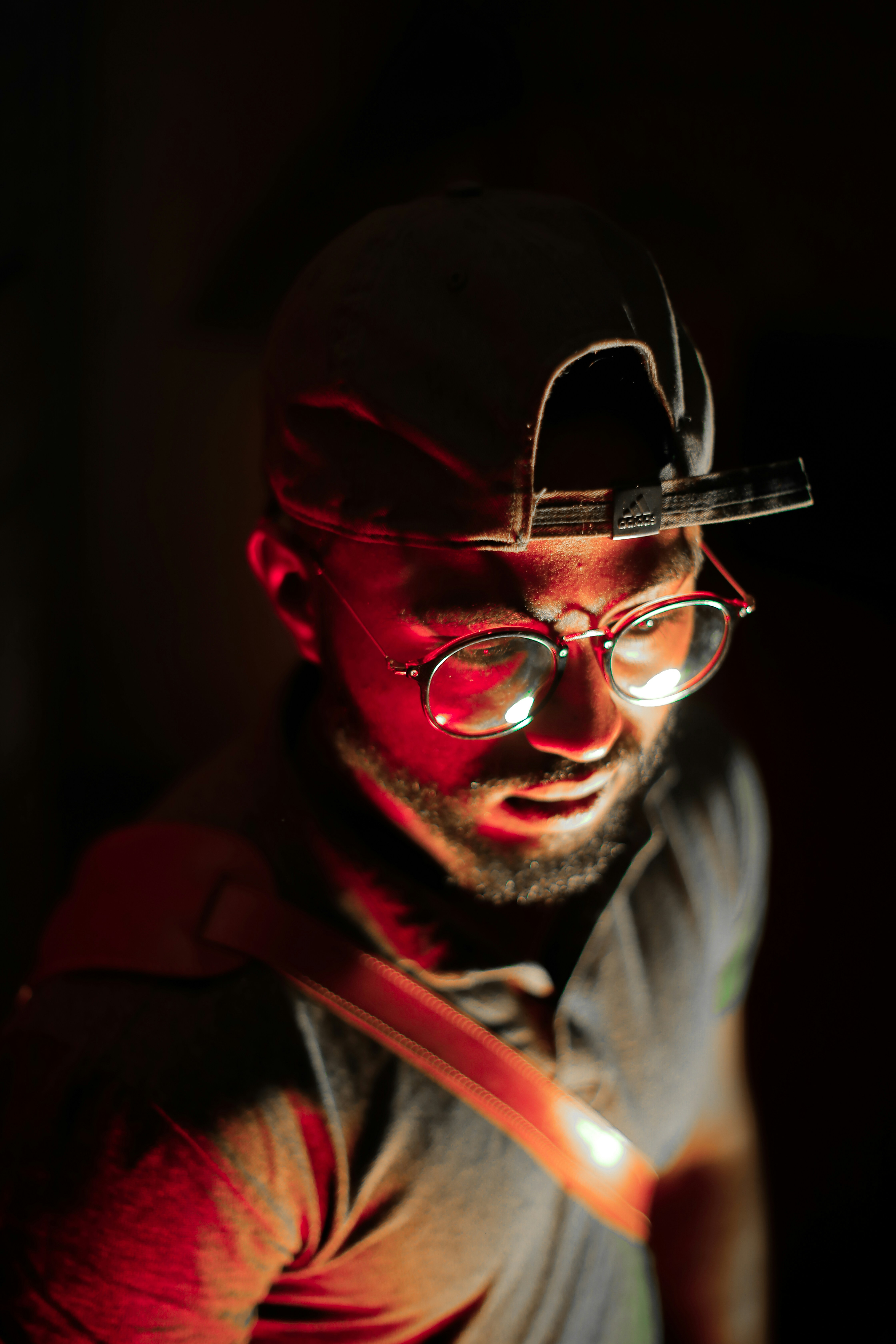 Focused Intensity: The Tilted Gaze in Dim Neon Light