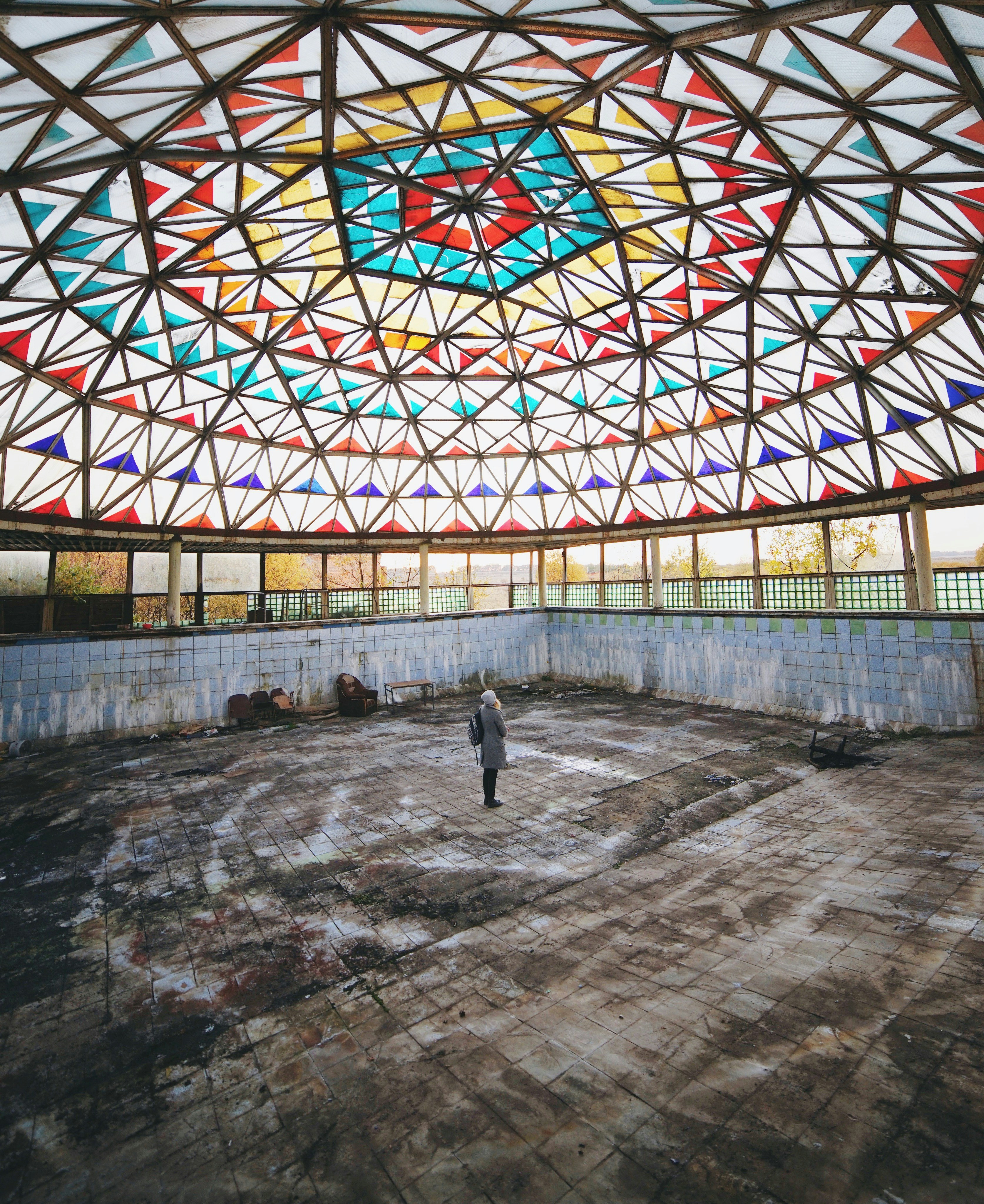 Diamond Helix of Light: A solitary figure centers beneath a kaleidoscopic dome
