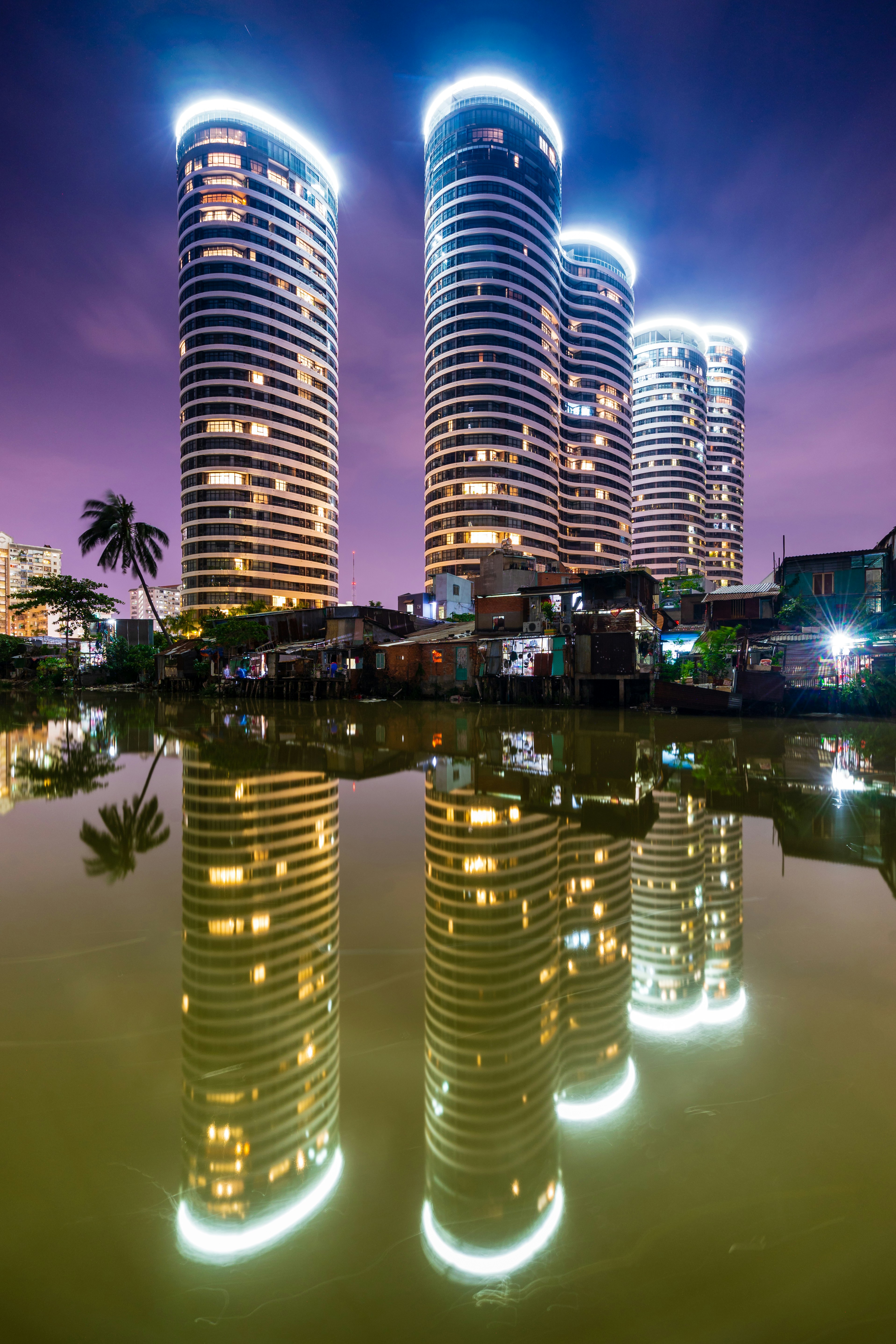 Black high rise buildings and body of water photo – Free Building Image ...