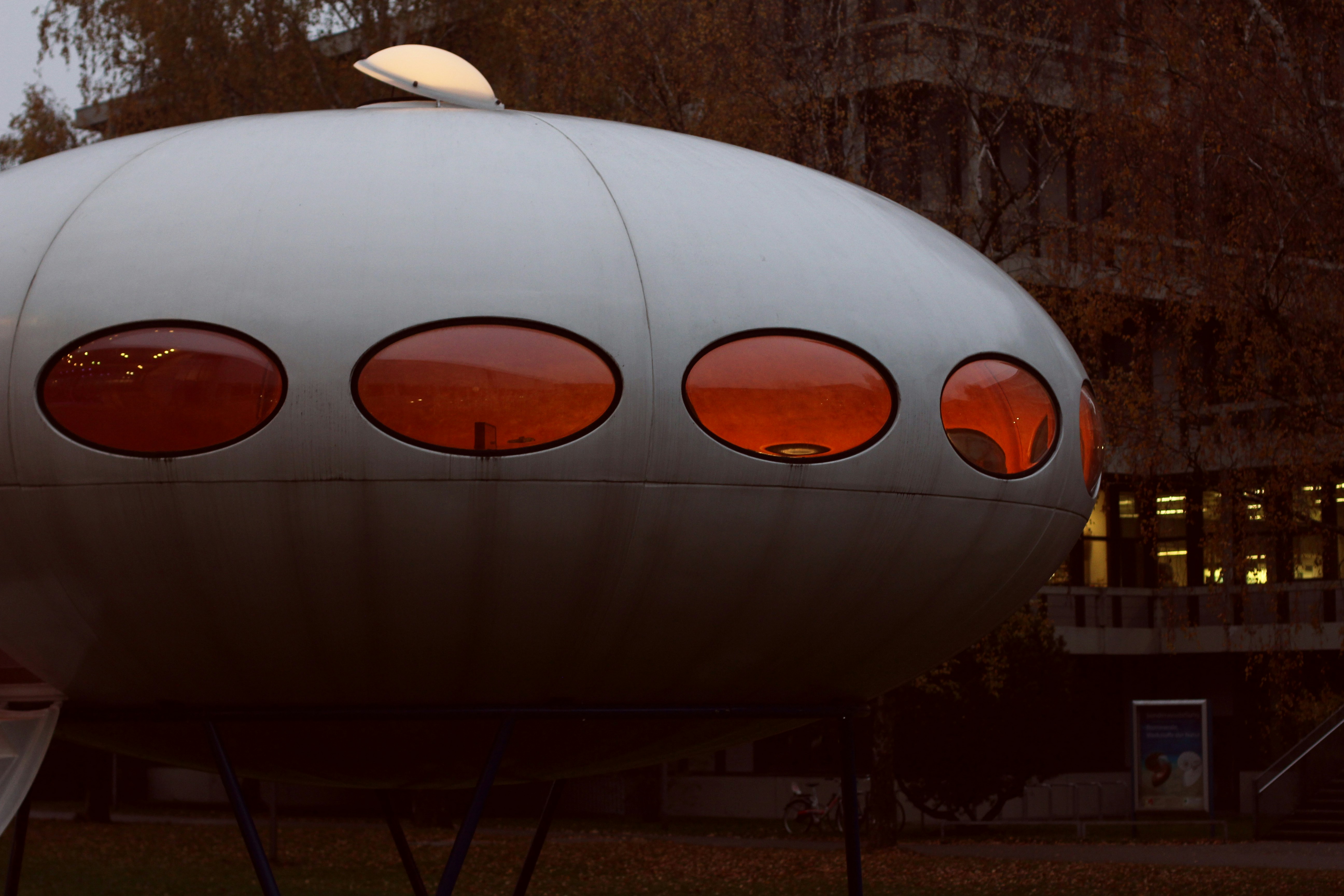 Dusk Dialog with a Red-Windowed Dome: A Park UFO Pavilion