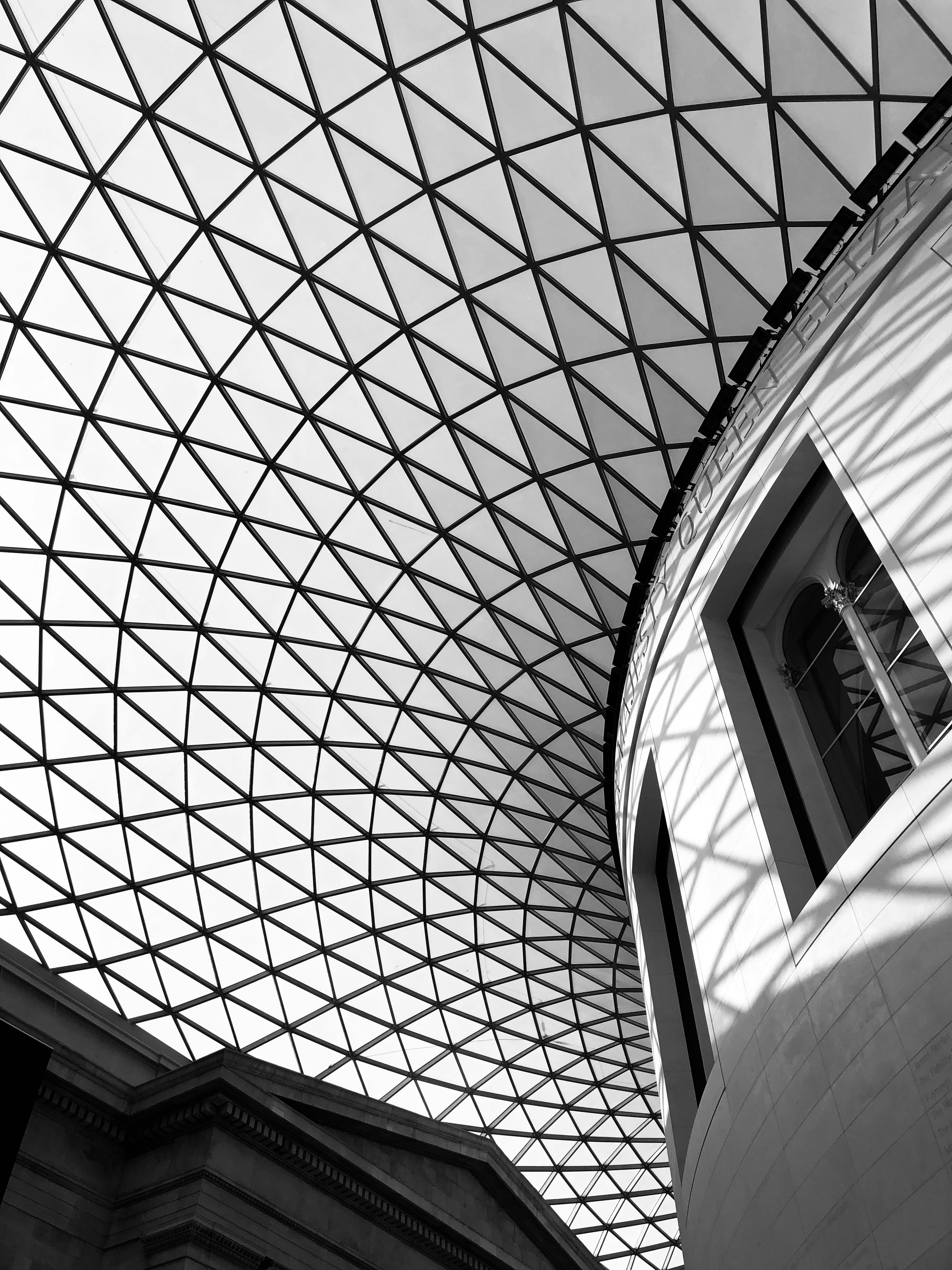 Diamond Grid Over a Curved Wall: Shadows in an Atrium