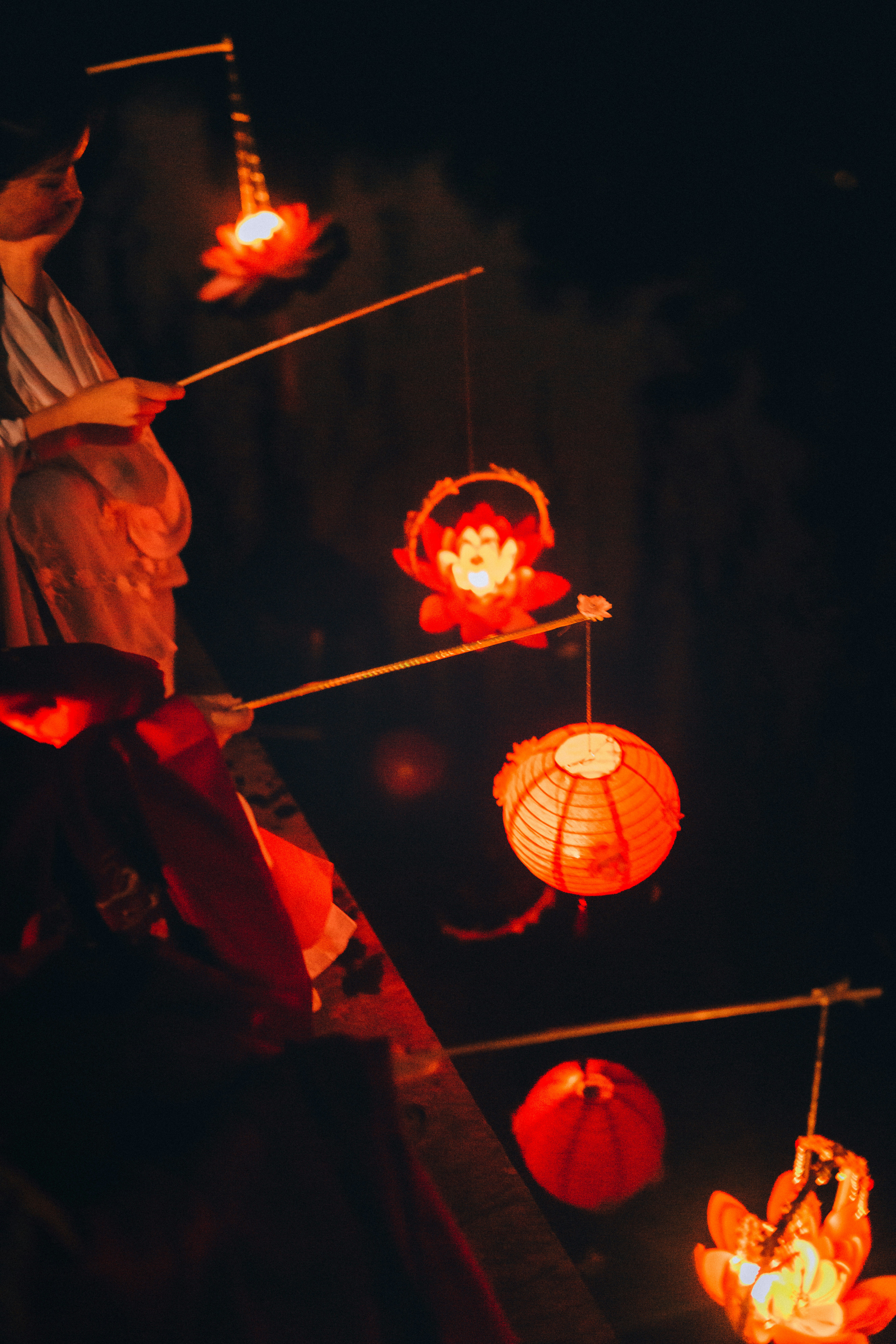 Lanterns on a Night Rampart: Firelight and Floating Orbs