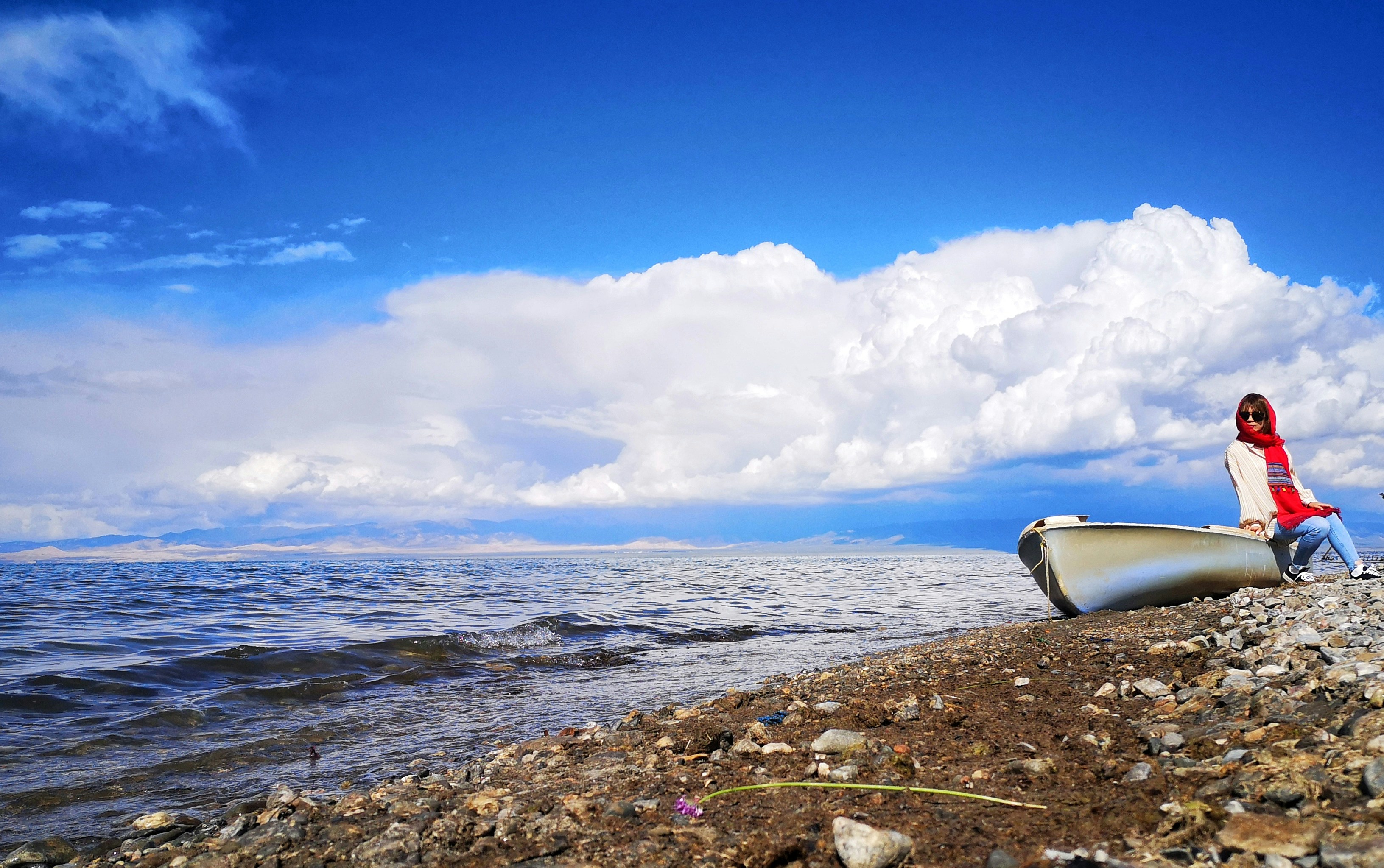Boater at the Shoreline: A Quiet Moment by the Bow