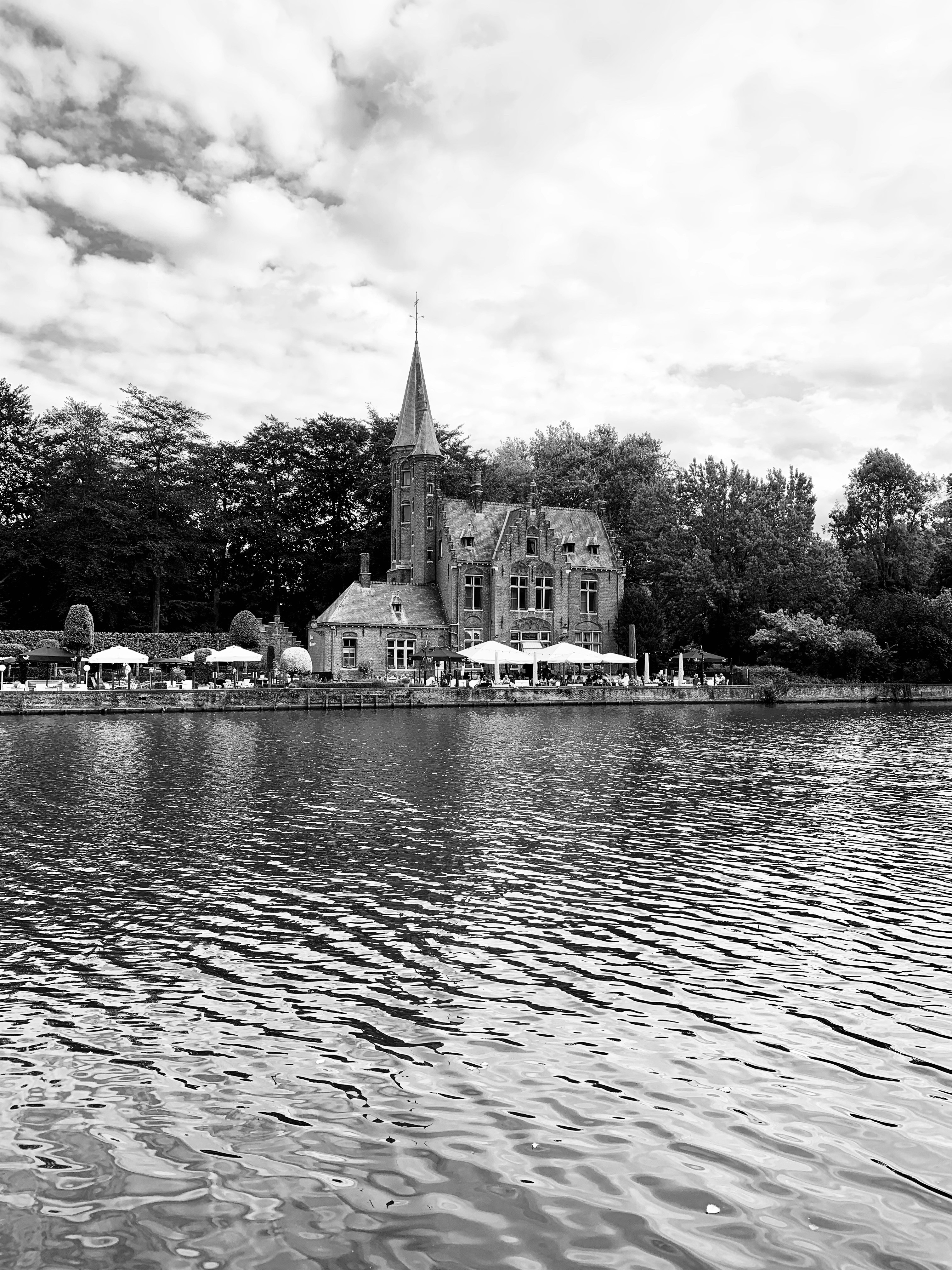 grayscale photo of river near house