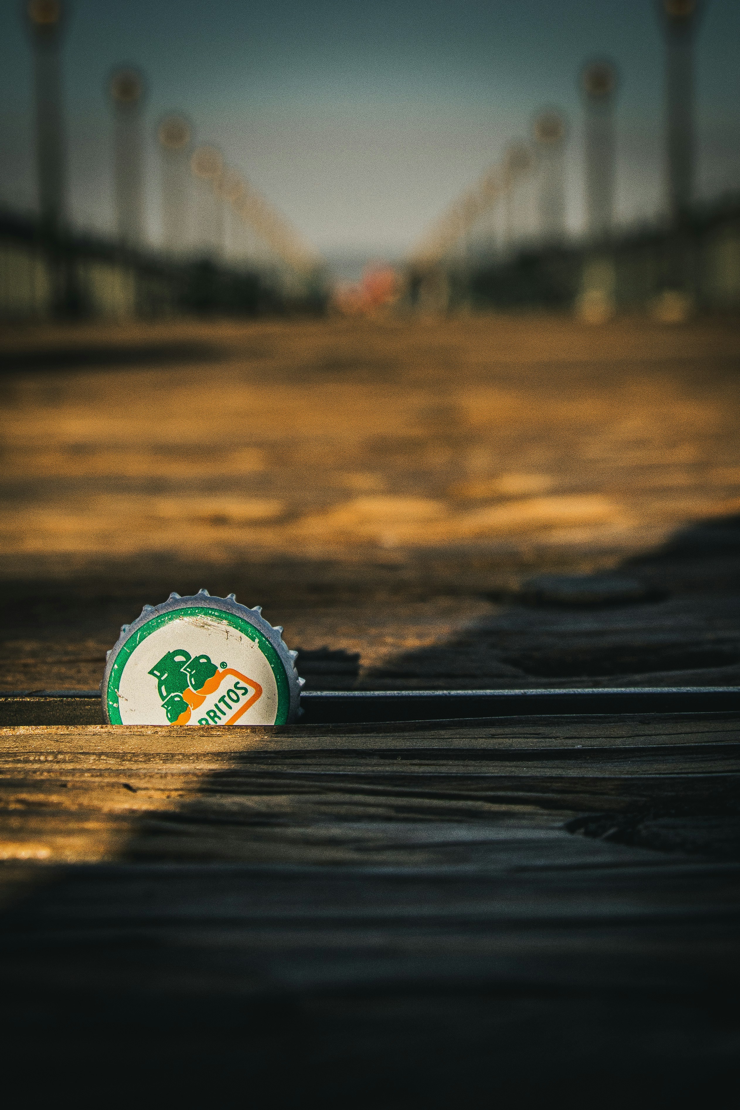 Driftwood Path: A Cola Cap and Sunset on the Pier