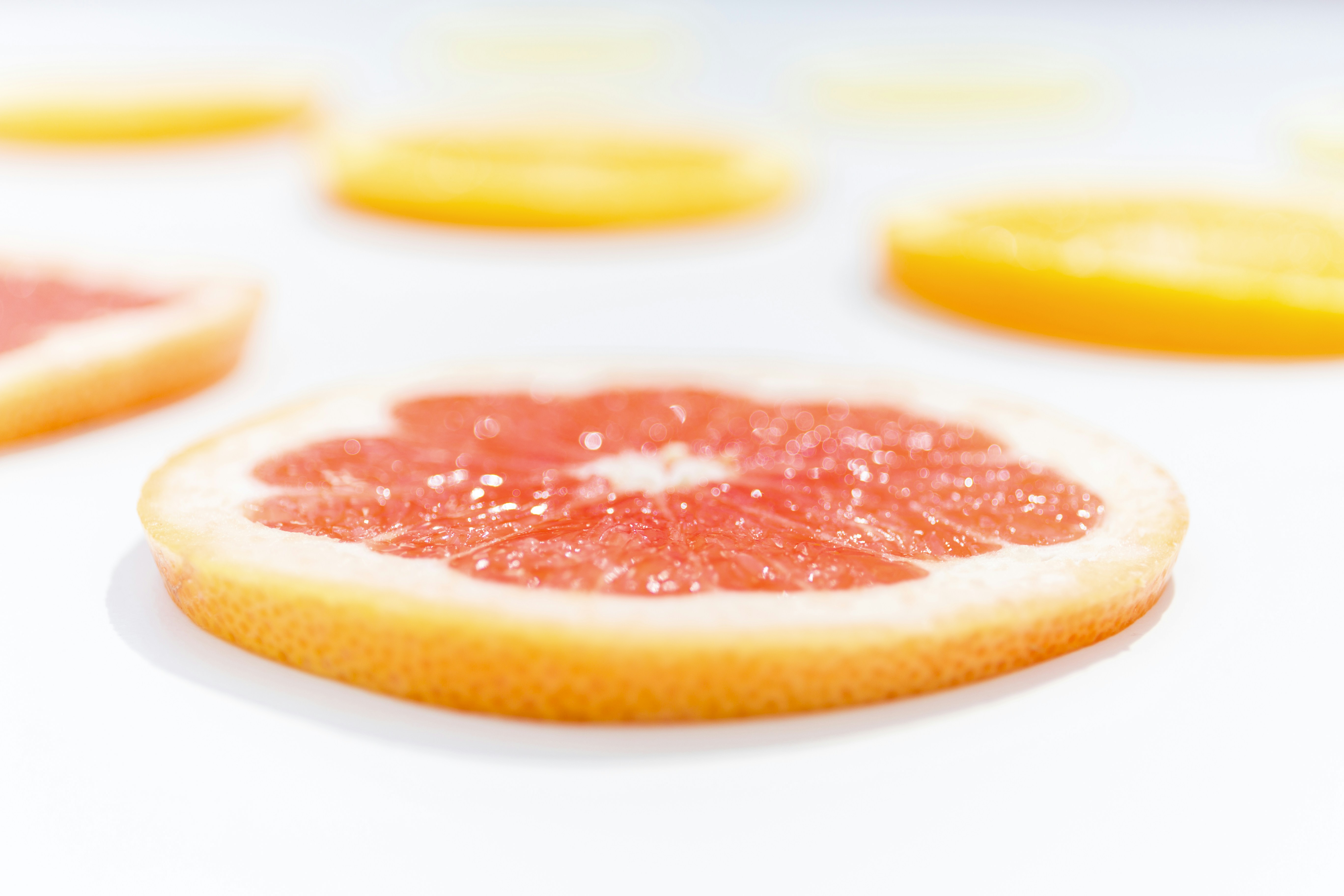 Grapefruit Glow: A Sharp Foreground Slice in a White Studio
