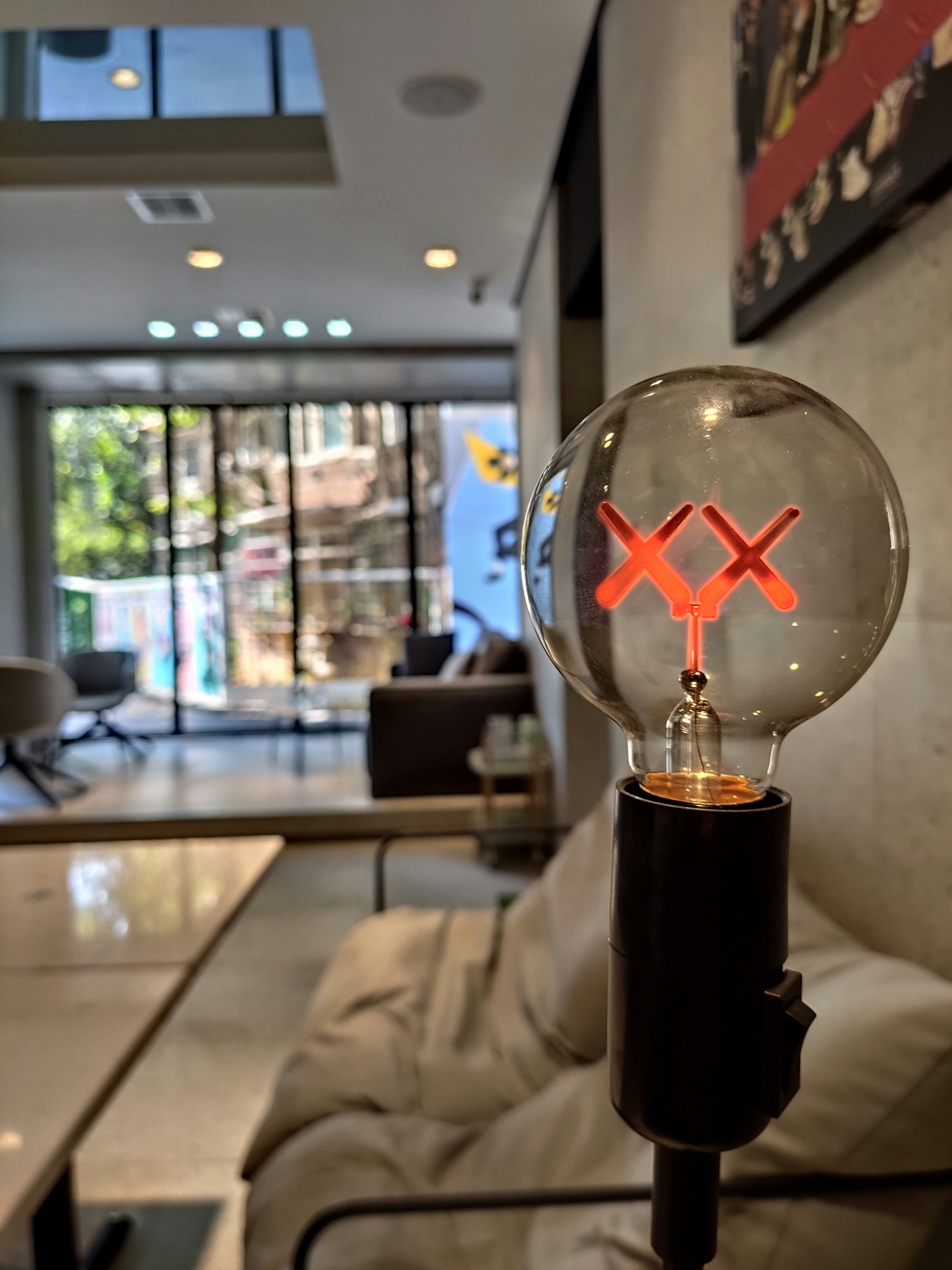 Neon XX in a Glass Bulb Anchoring a Modern Living Room