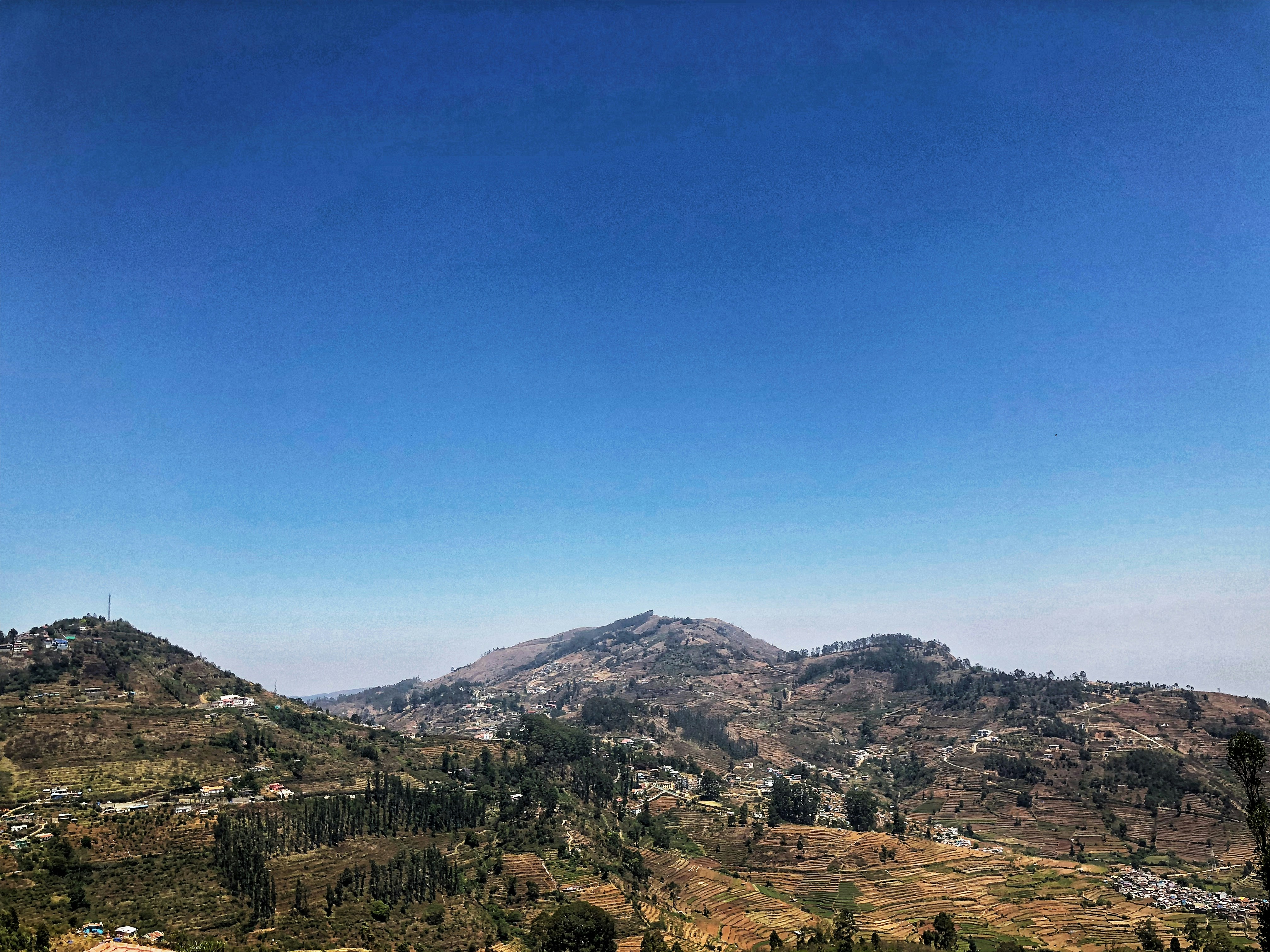 Terraced Hills Under a Crowned Sky
