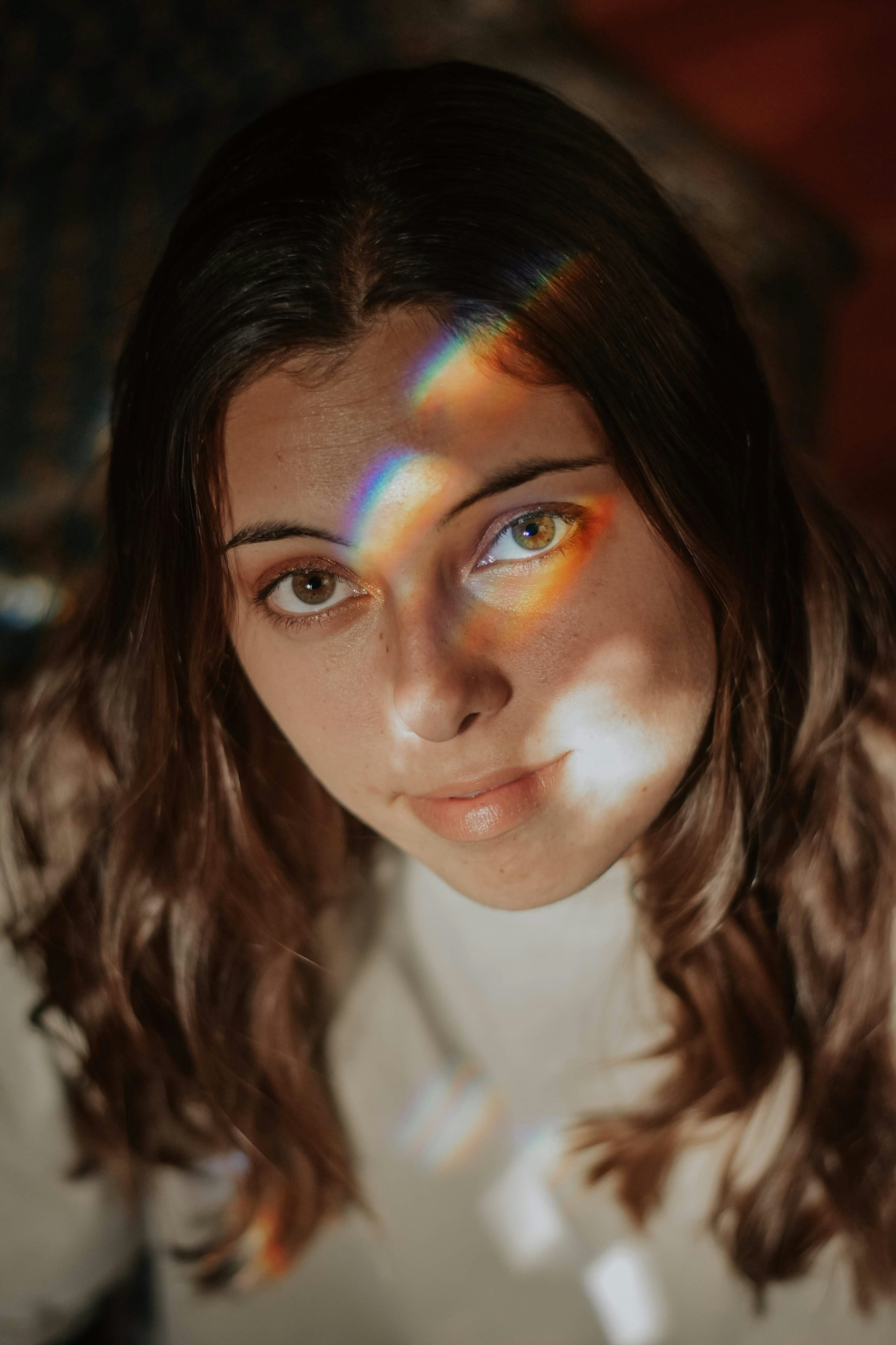 Prismatic Gaze: Rainbow Light Framing a Portrait