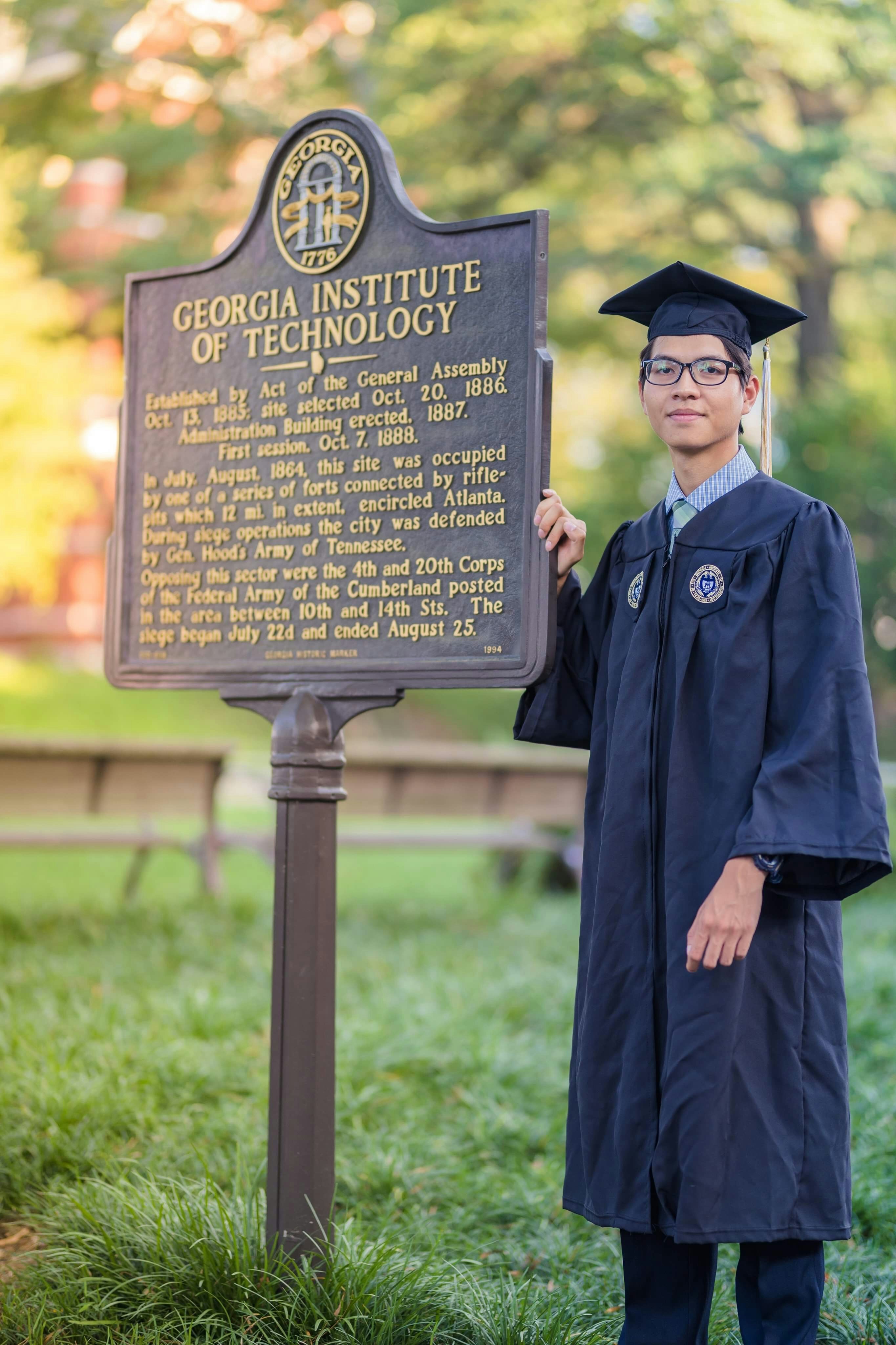 Man standing beside signage photo – Free Academic gown Image on Unsplash