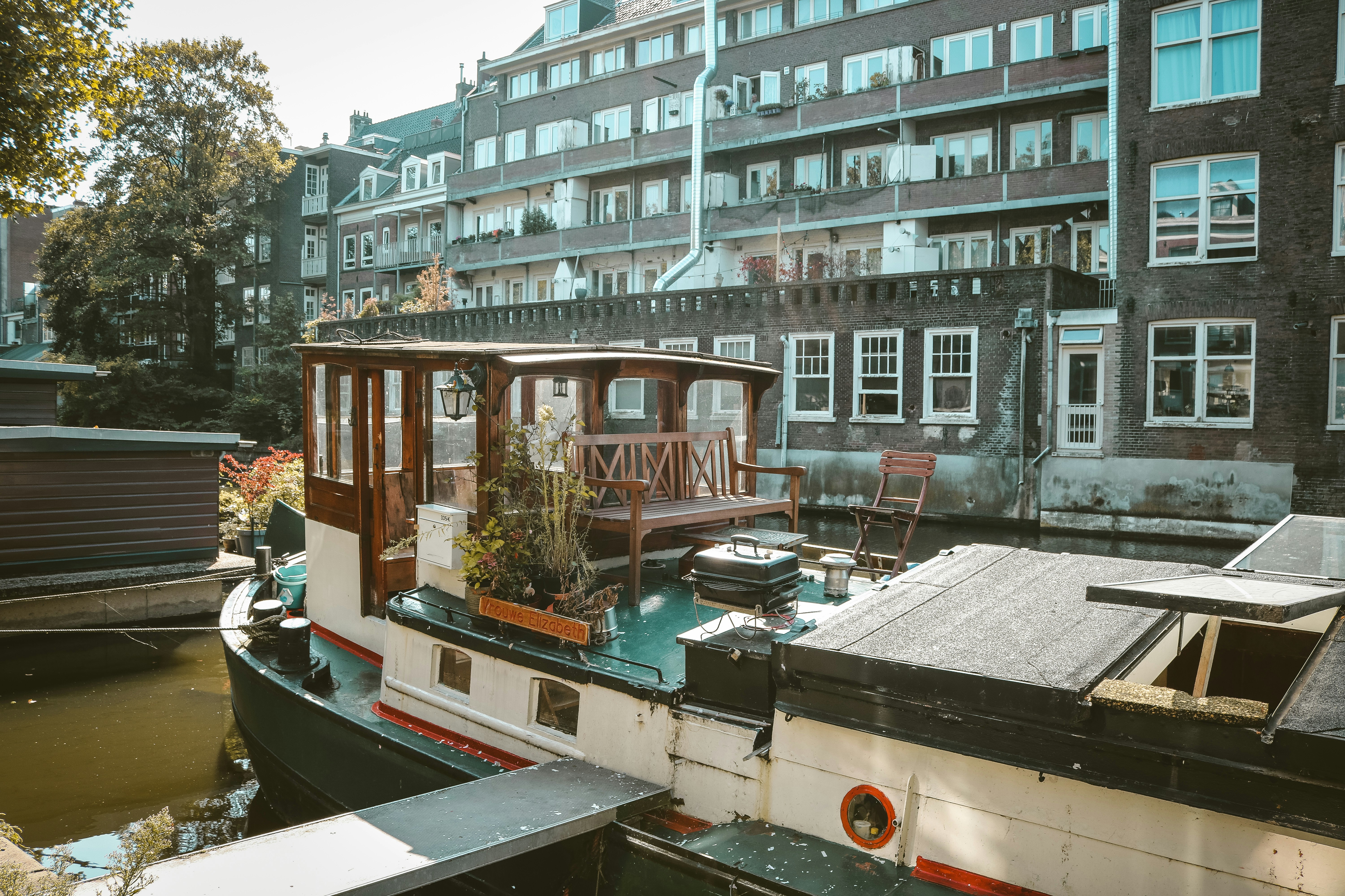 Canal Houseboat Terrace Framed by City Brickwork
