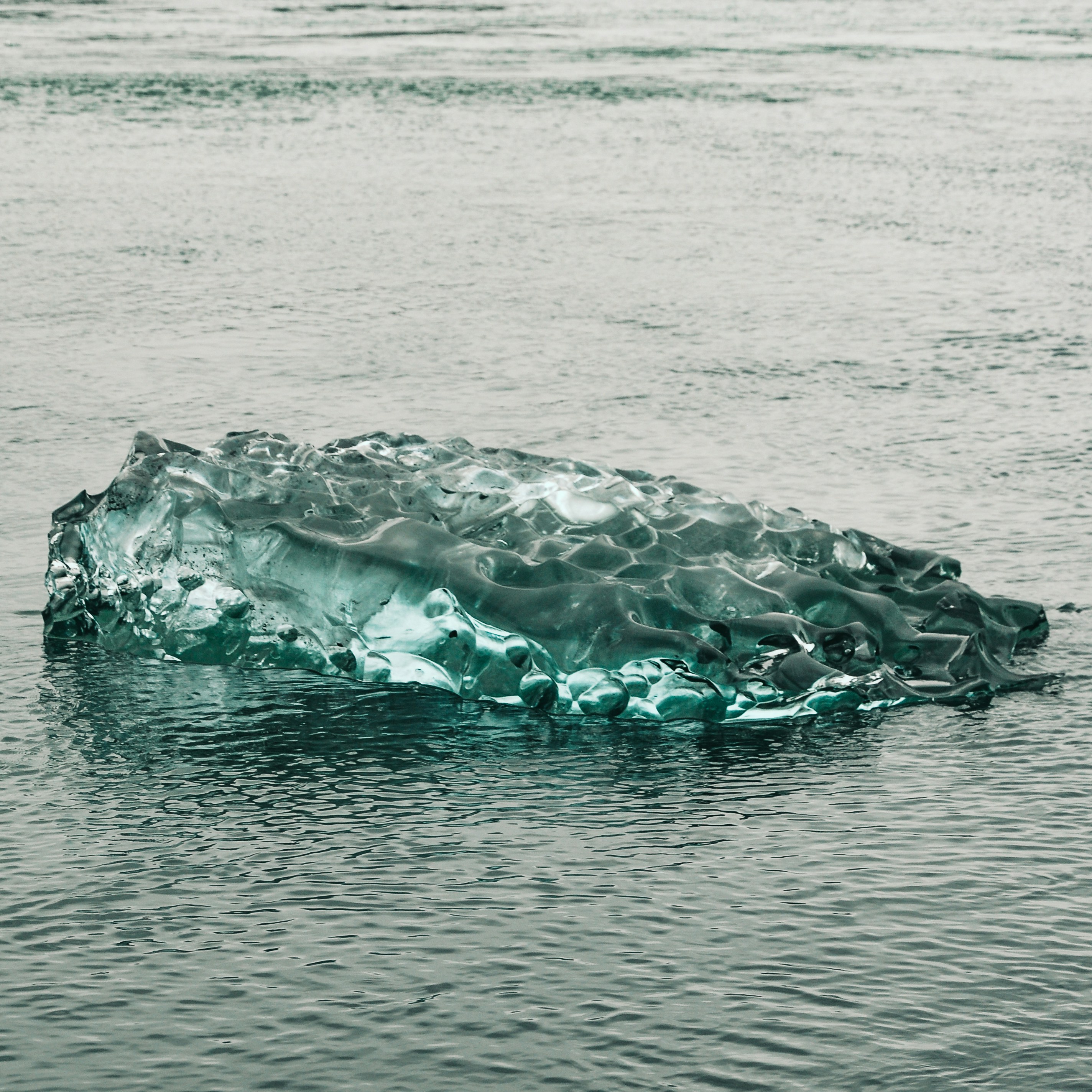 Teal Ice Floe on a Glassy Sea: Geometry of Light