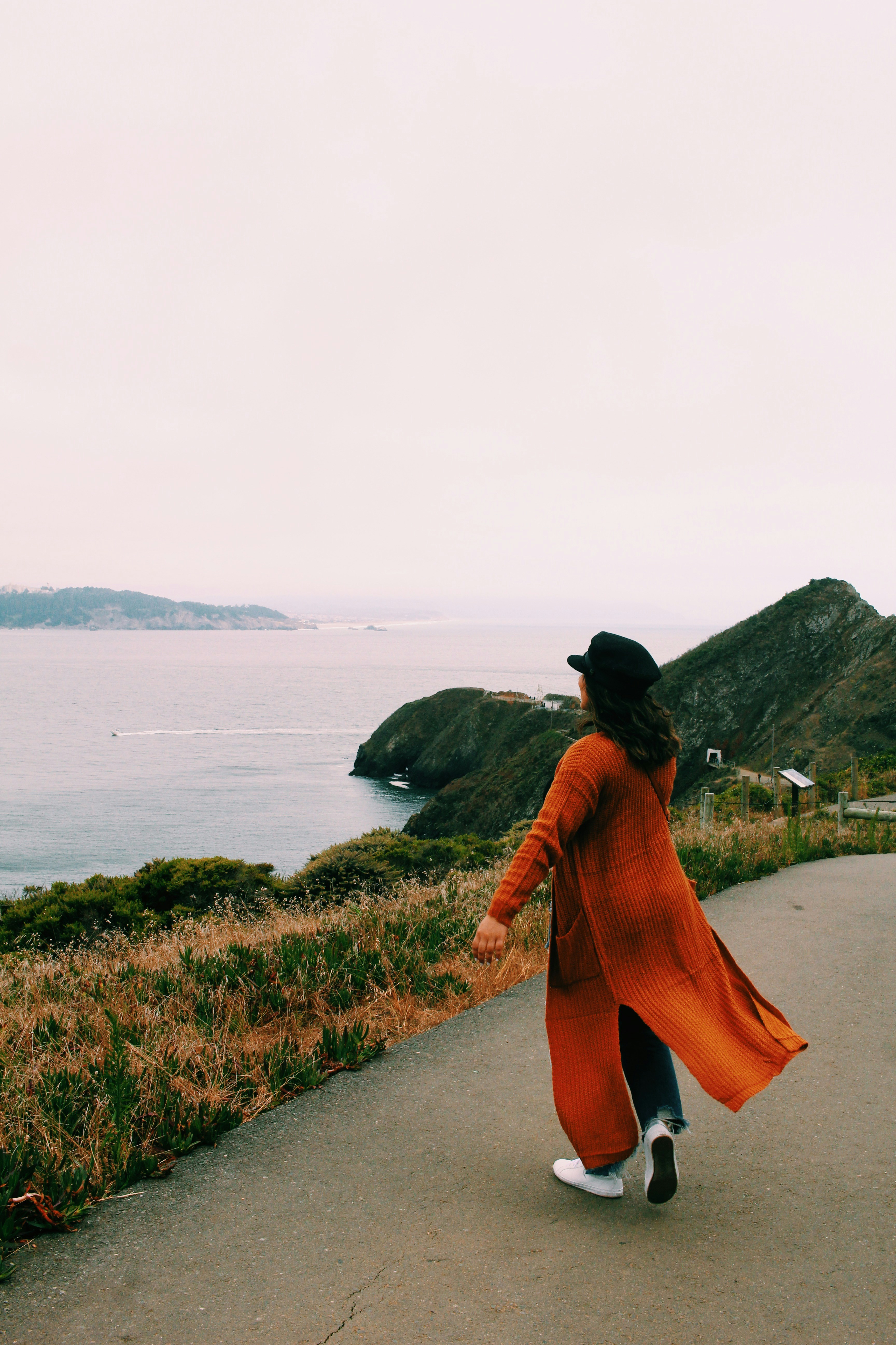 Orange Gesture Along the Cliff Path: A Quiet Coastal Moment
