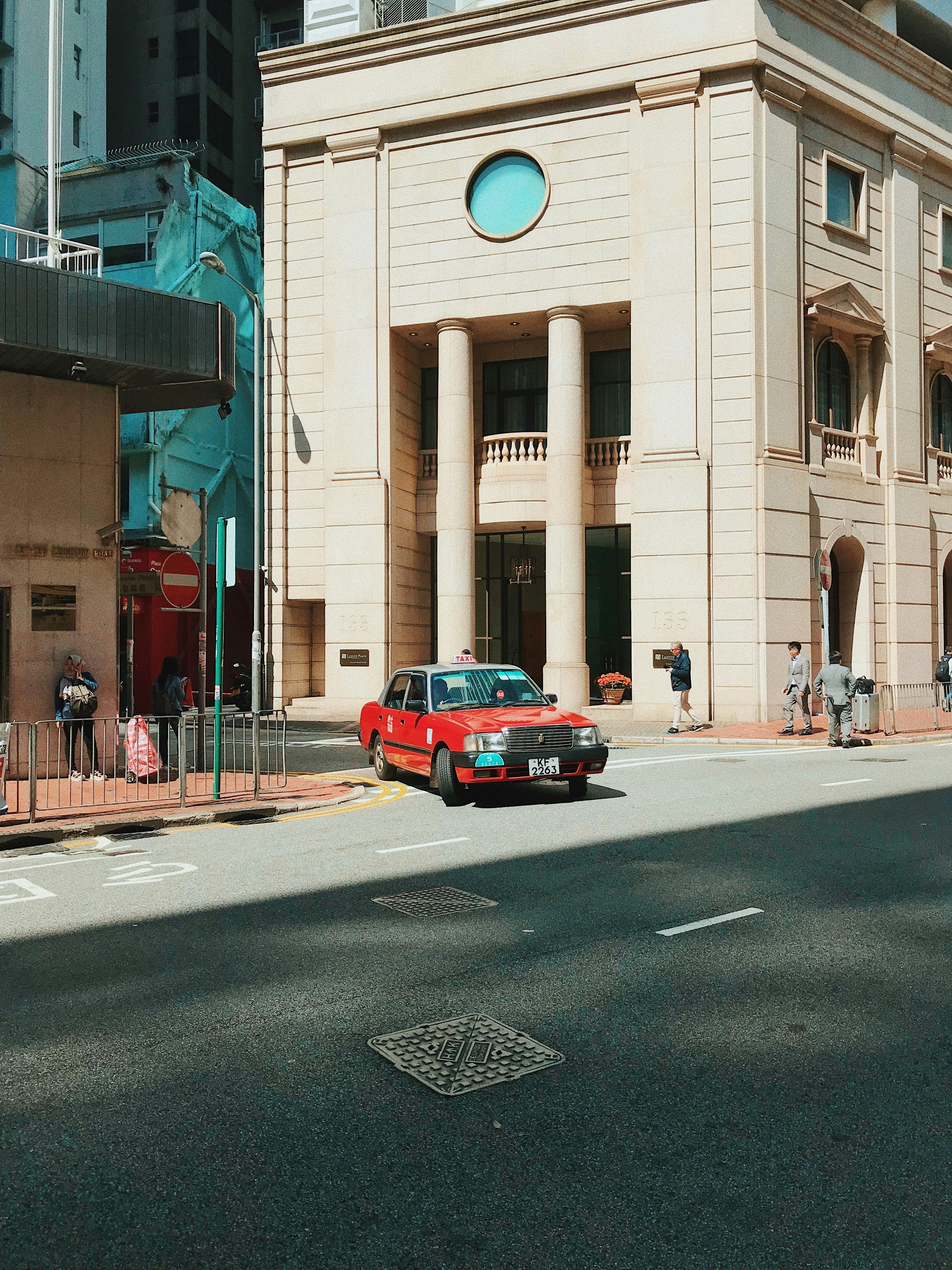 Red car near building photo – Free Hong kong Image on Unsplash