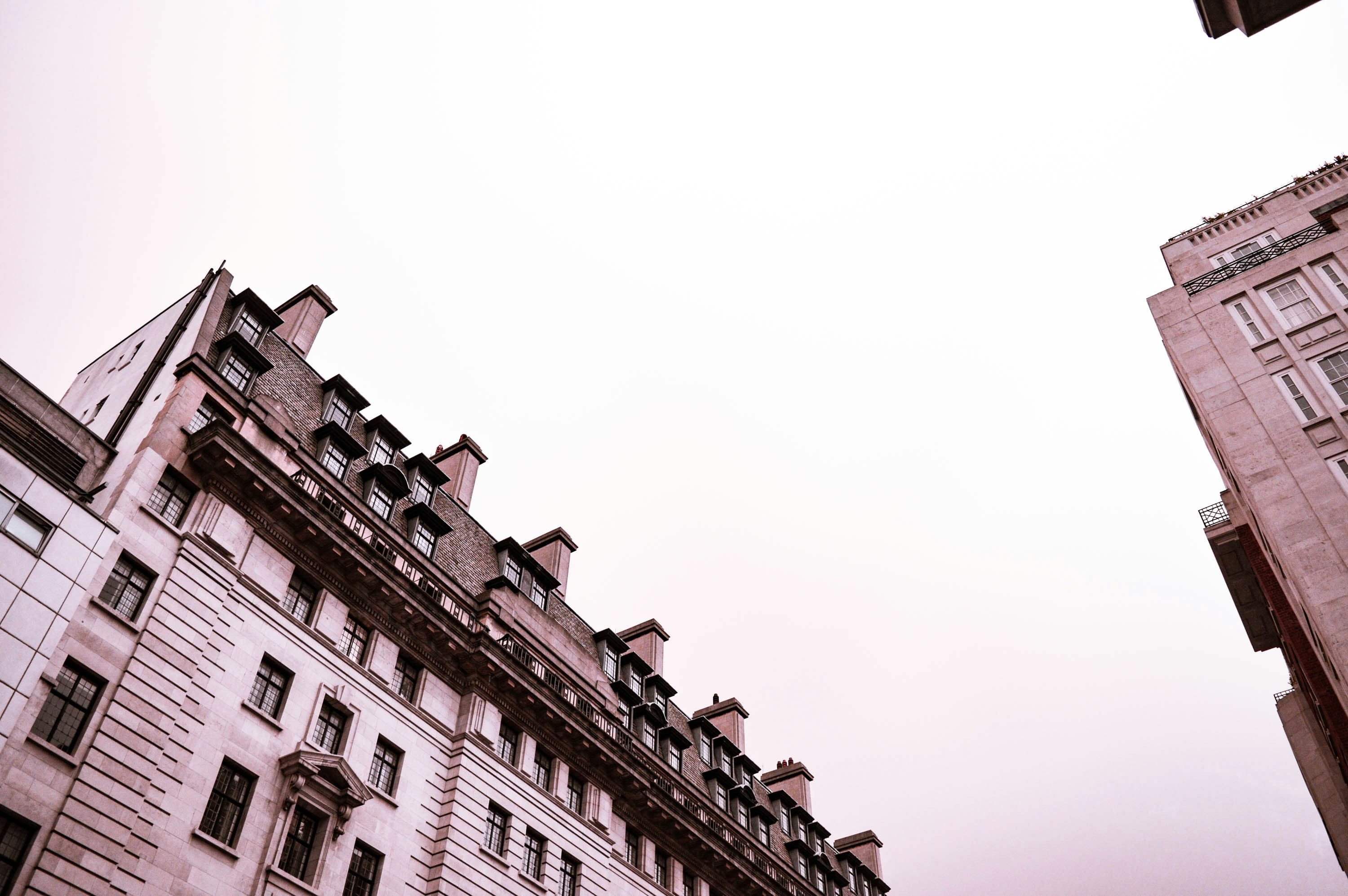 Tilted Facades Under a Blush Sky