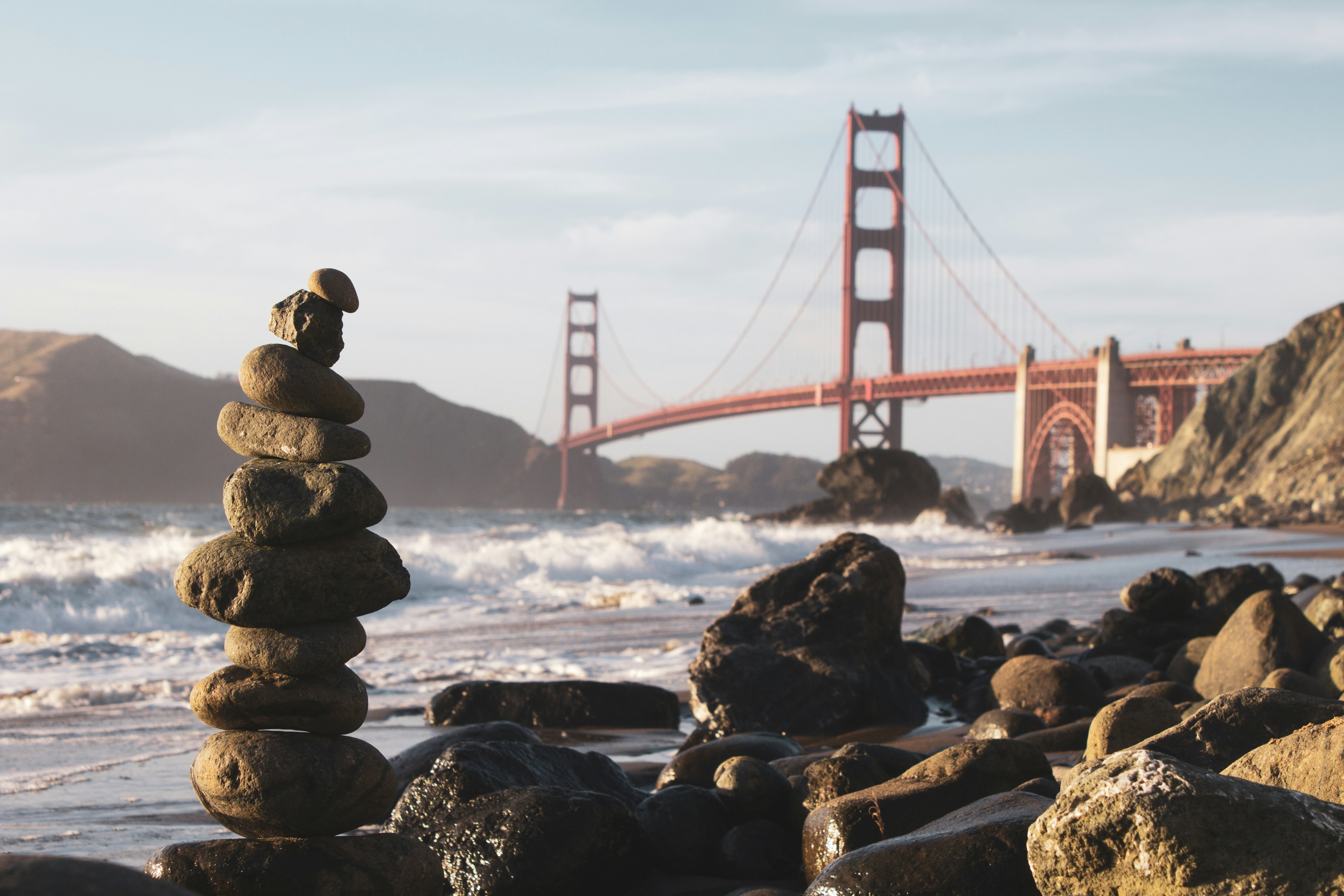 Pebble Tower by the Bay: Foreground Cairn with the Golden Gate in Distant Light