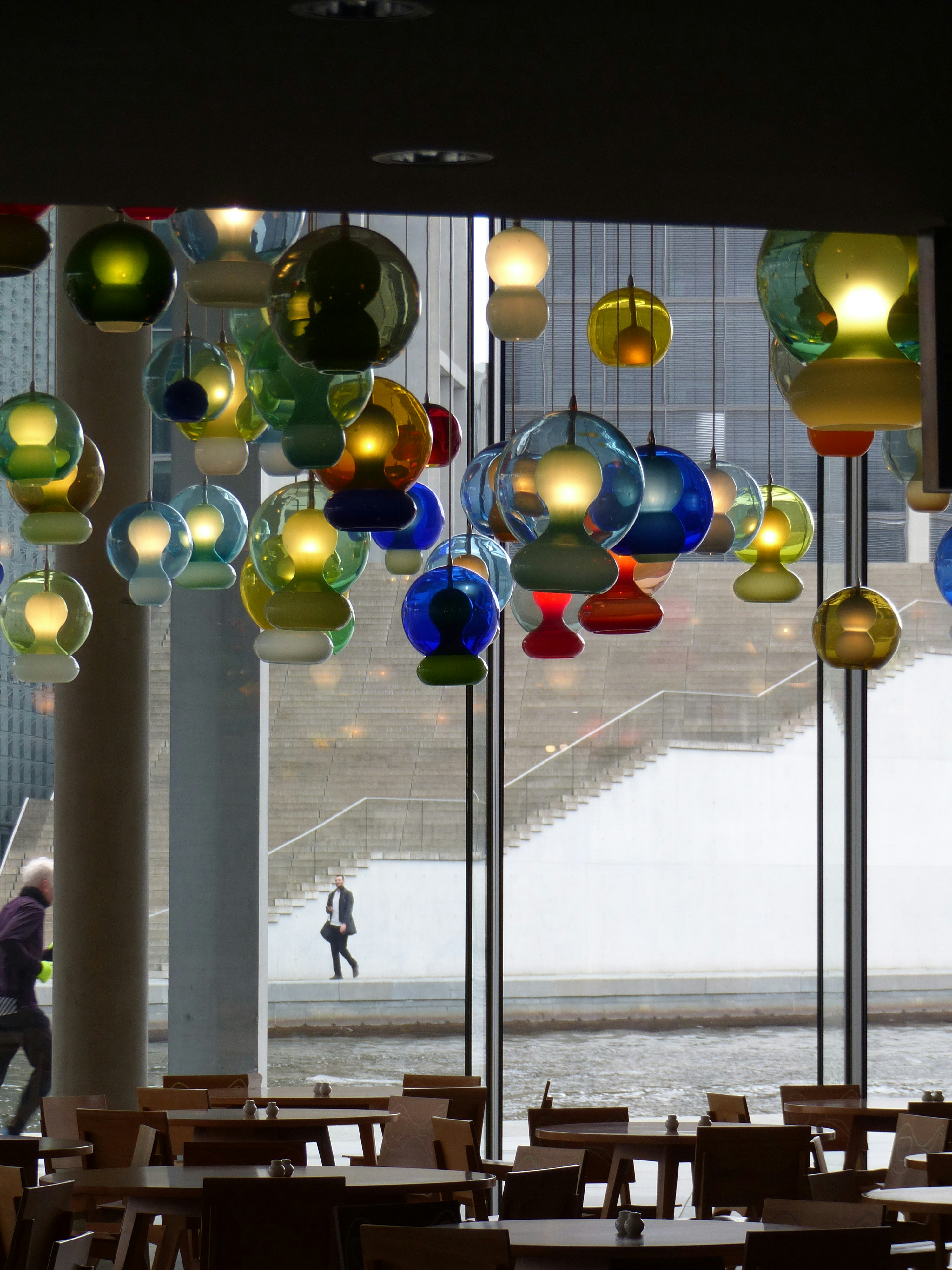 Spectrum in Suspension: Glass Orbs Hover Over a Quiet Café