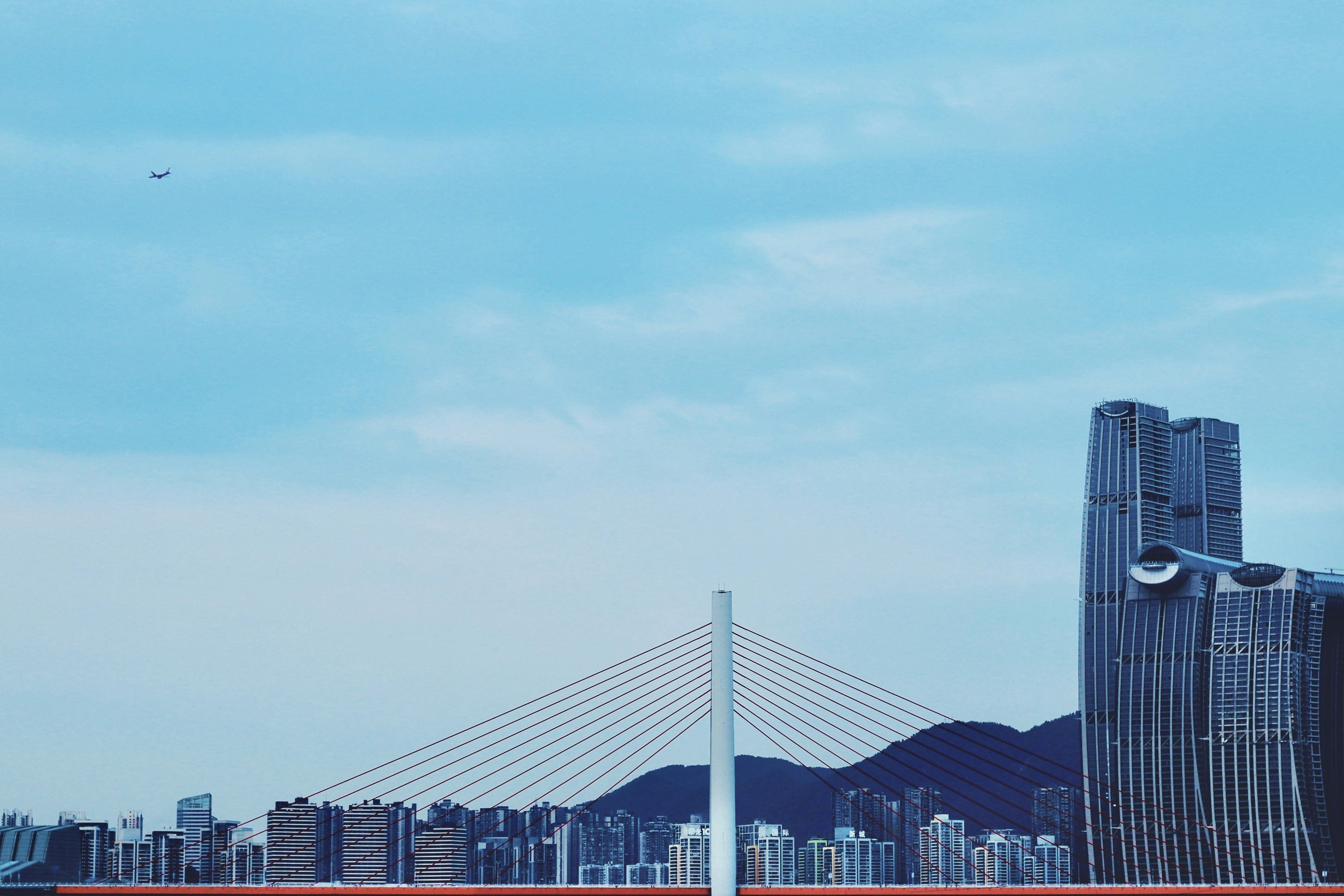 Gray bridge under blue sky photo – Free Blue Image on Unsplash