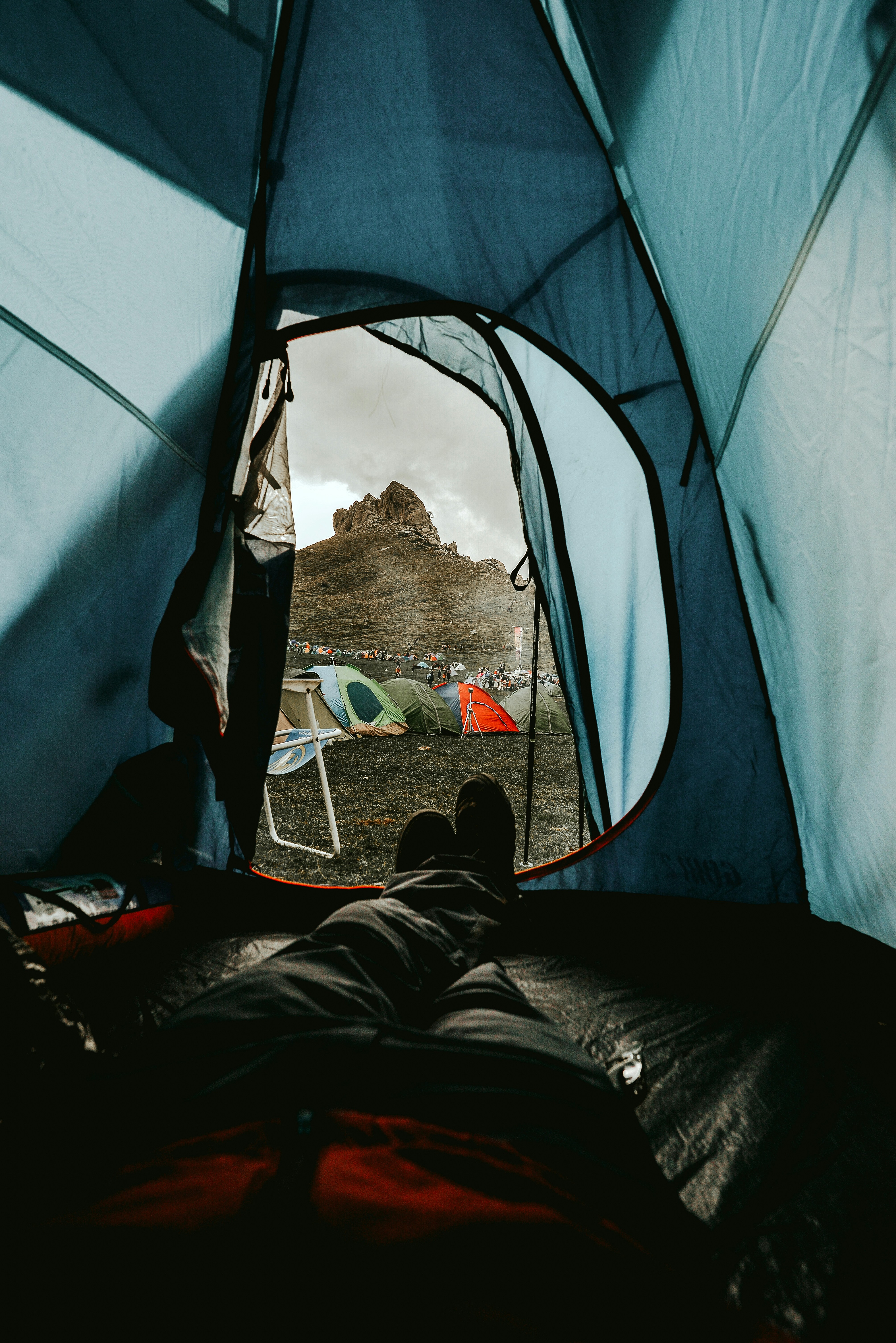 Person lying inside blue tent photo – Free Camping Image on Unsplash