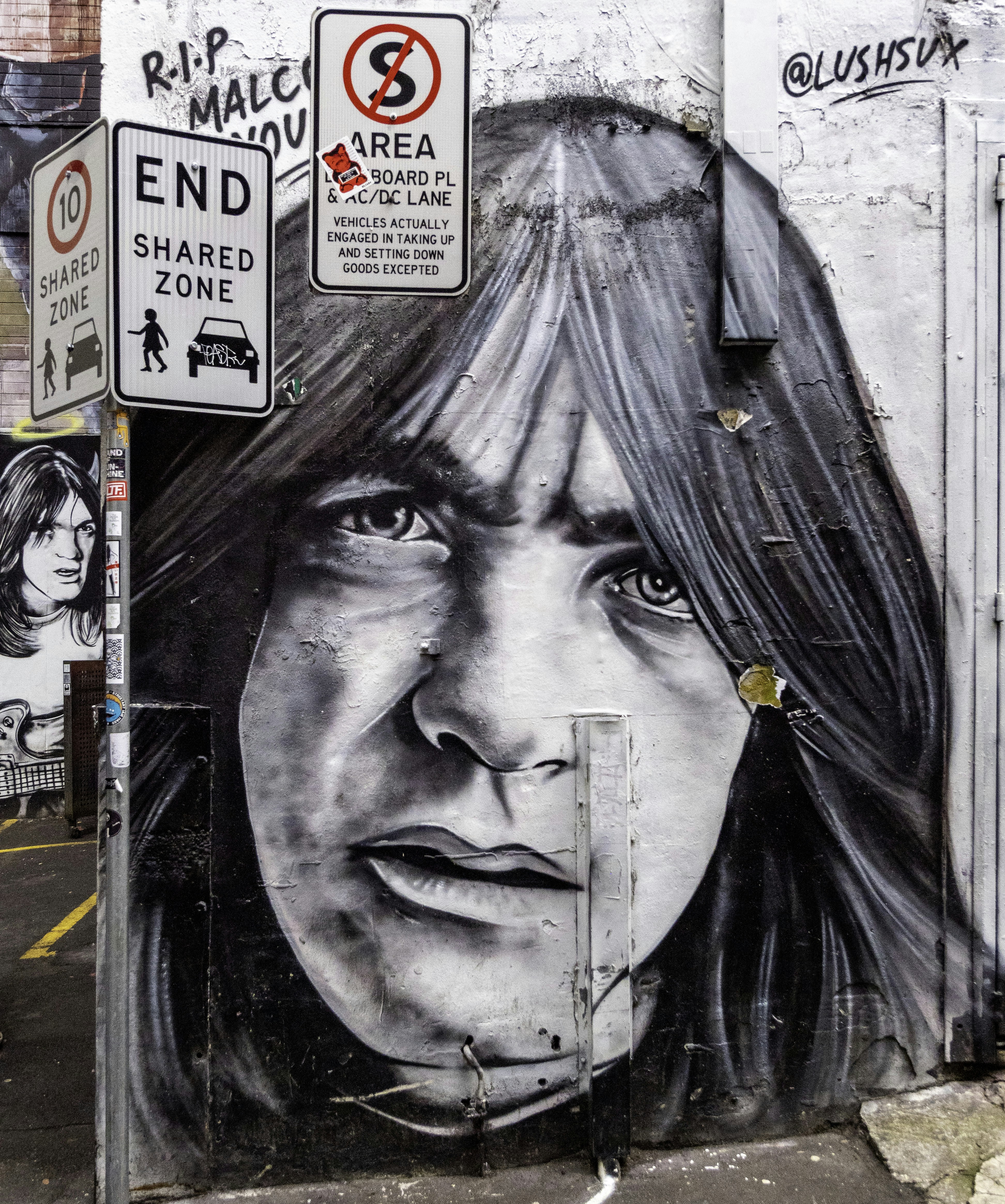 Eyes Beneath the Urban Graffiti: A Portrait in Concrete
