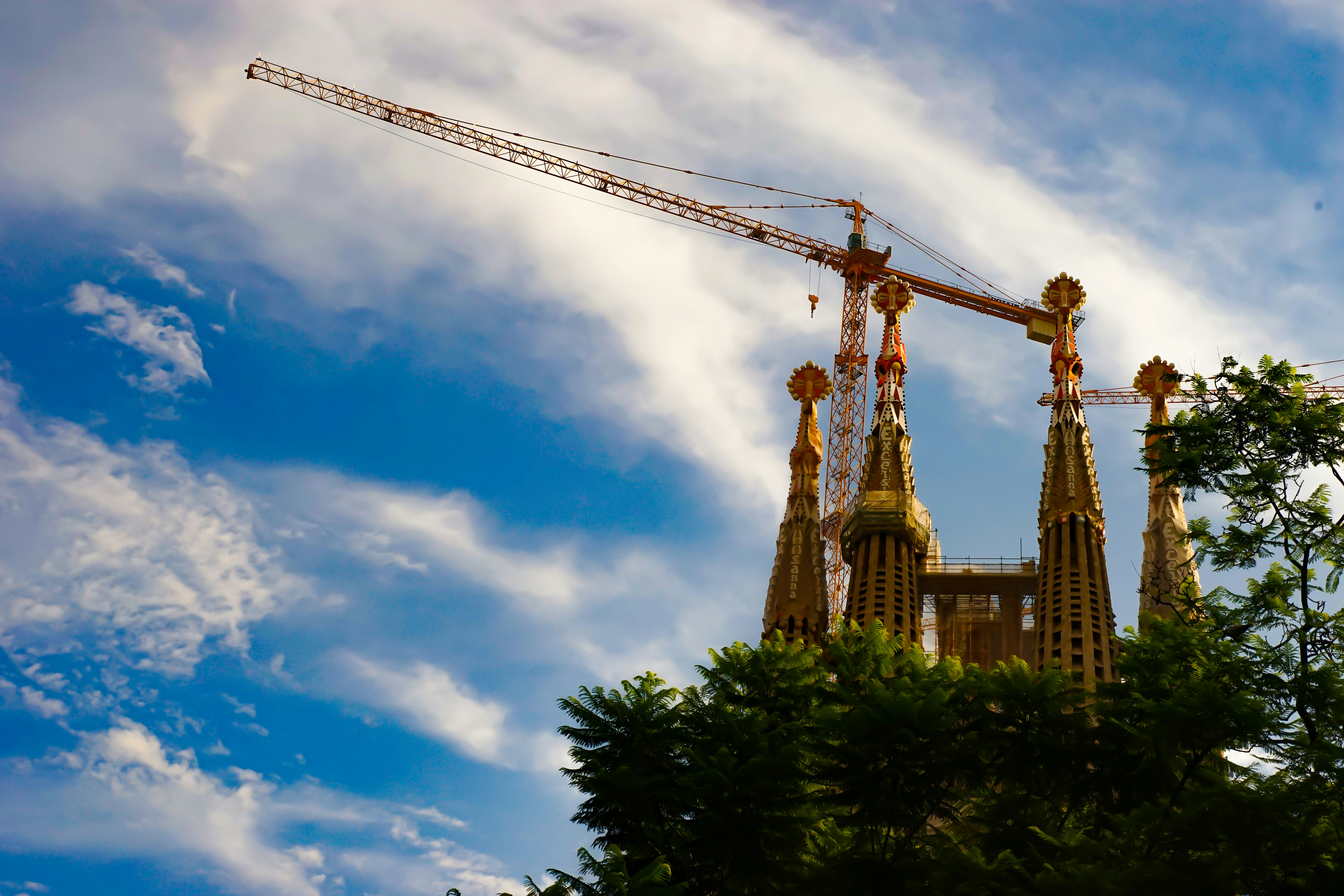 Crane Over Cathedral Spires: A Skyward Moment at Sagrada Família