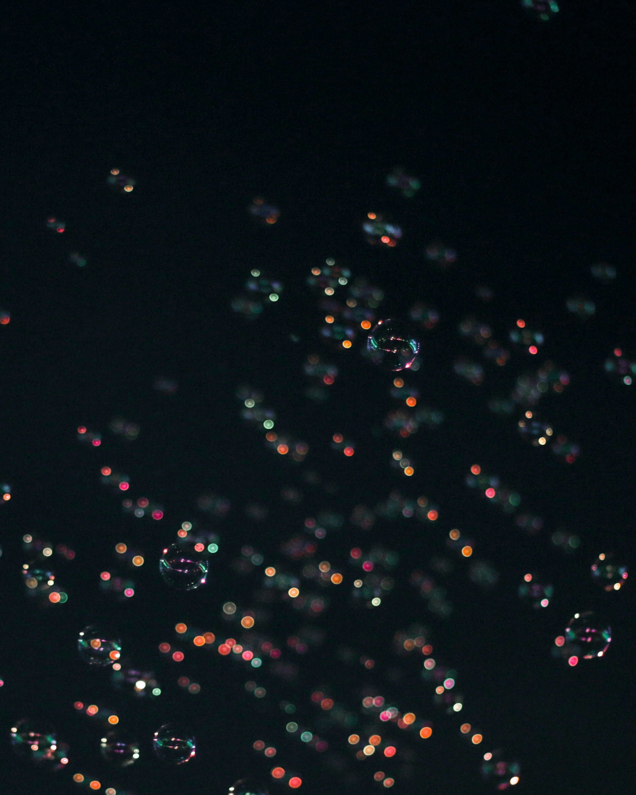 A lot of bubbles floating in the air at night photo – Free Colorful ...
