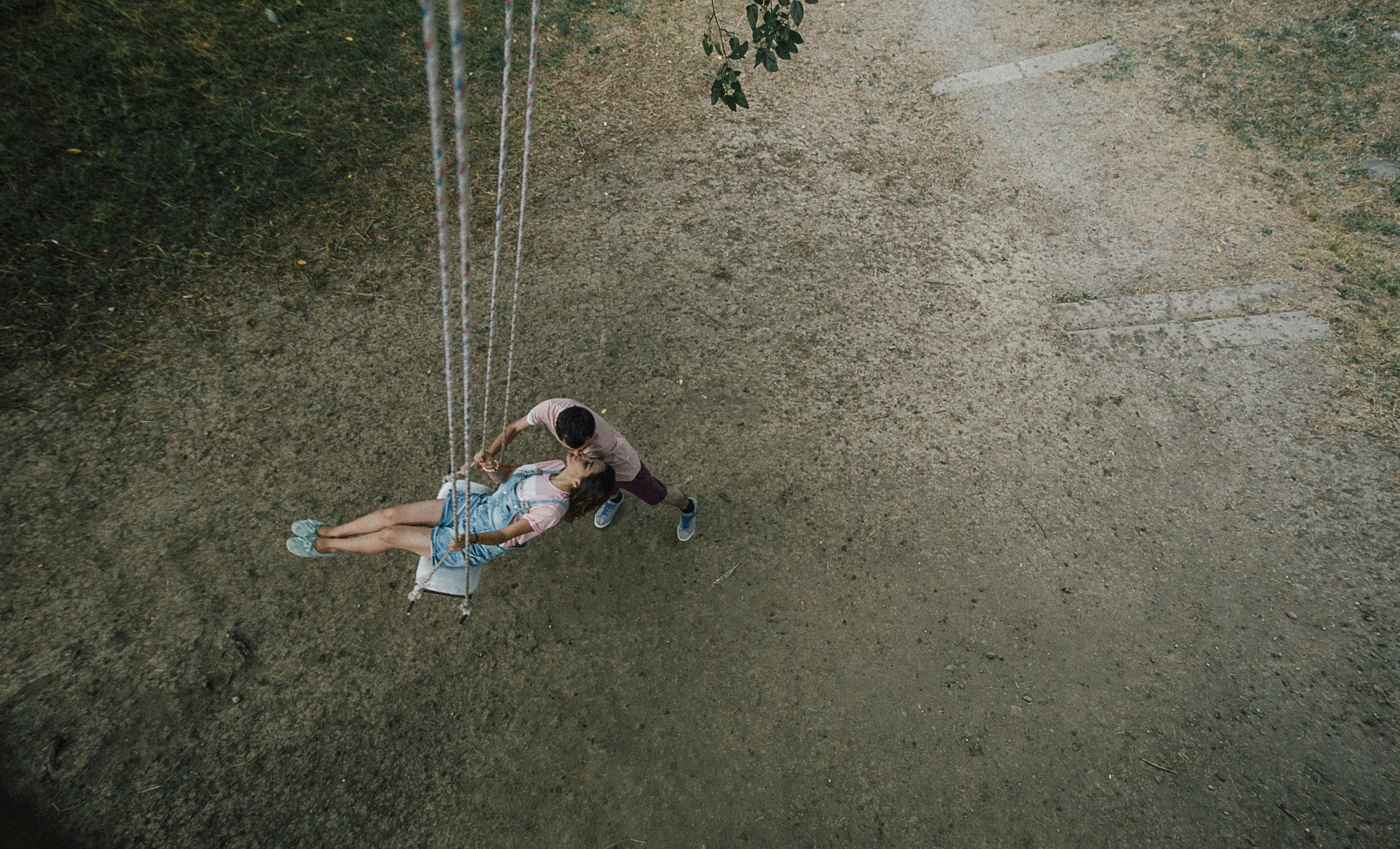 Woman riding on swing beside man close-up photography photo – Free ...