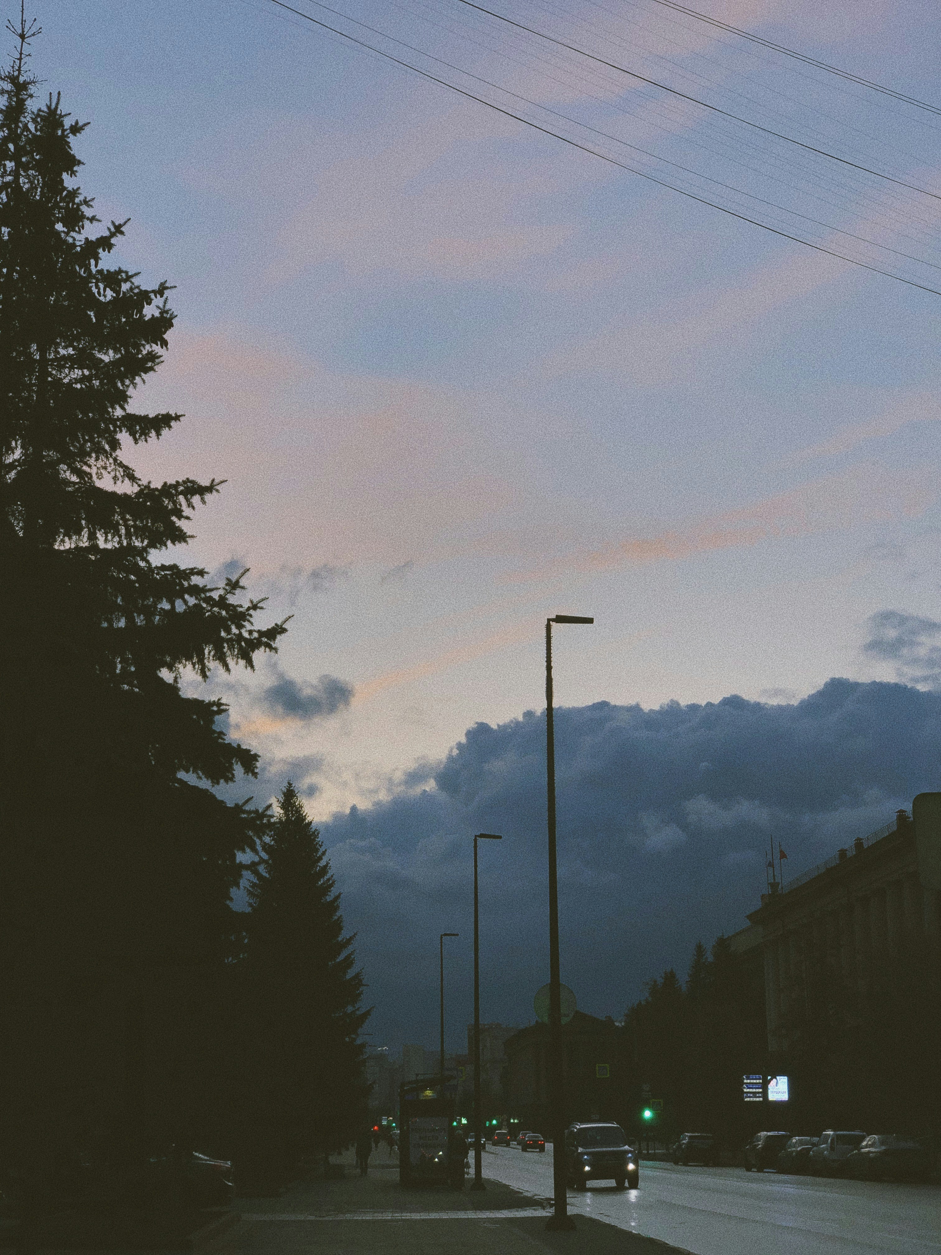 Dusk Boulevard Lumen: silhouettes, lampposts, and pastel skies