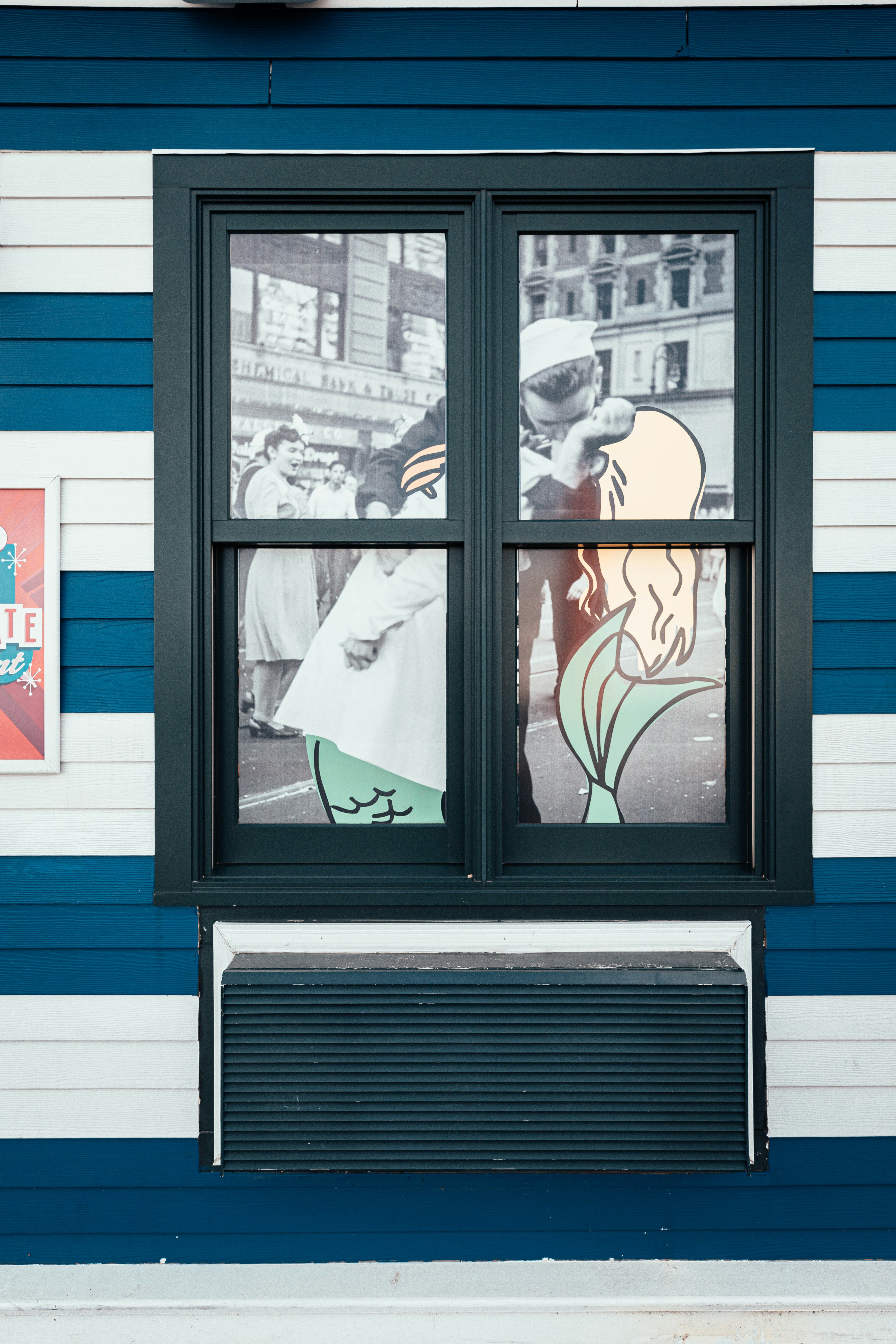 Comic-Panel Window: A Chestnut of Street Art Glares Through the Glass