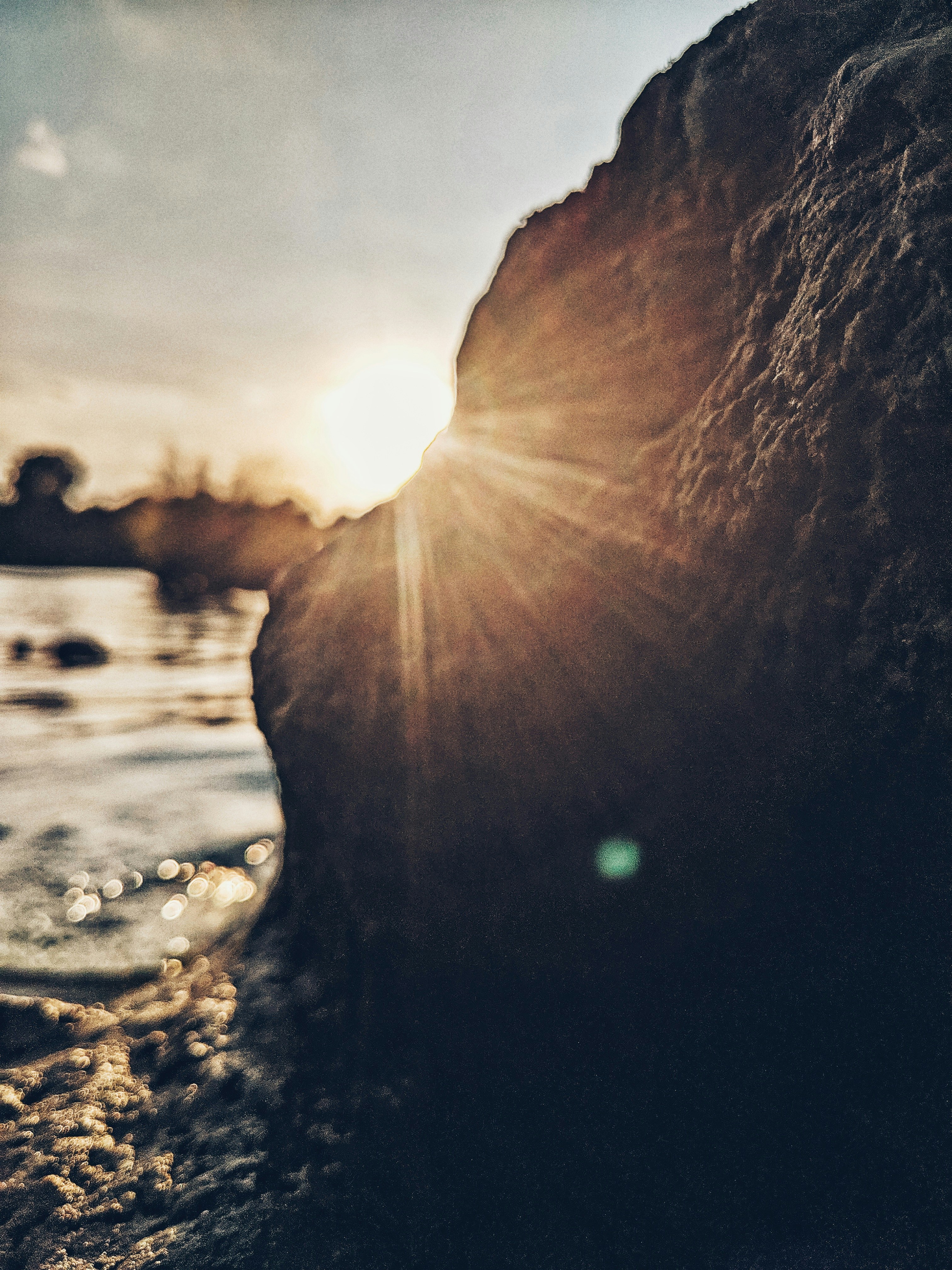 Sunburst Through the Crag: A Quiet Seaside Moment