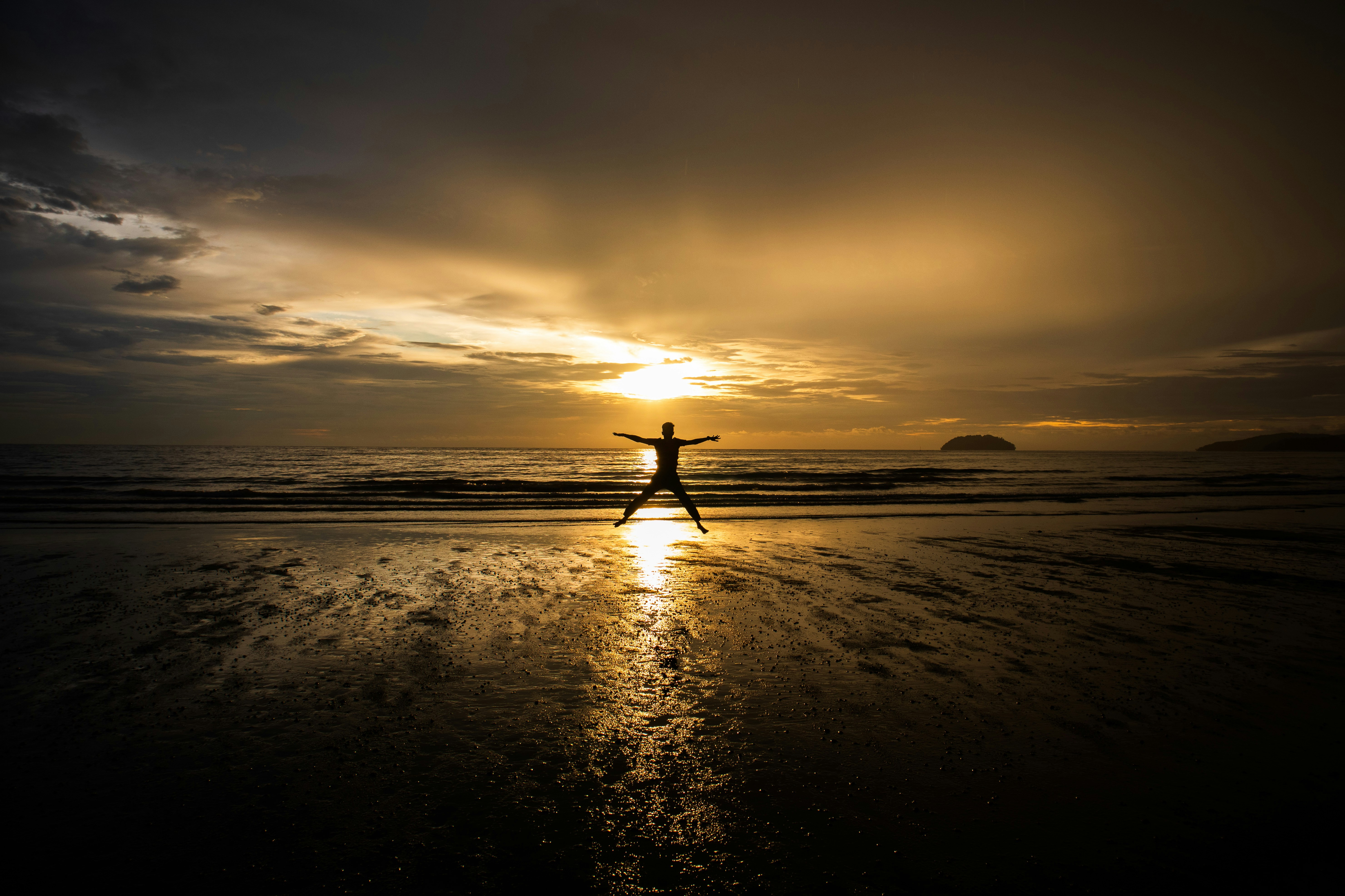 Sunlit Leap: A Silhouette at the Edge of Dawn
